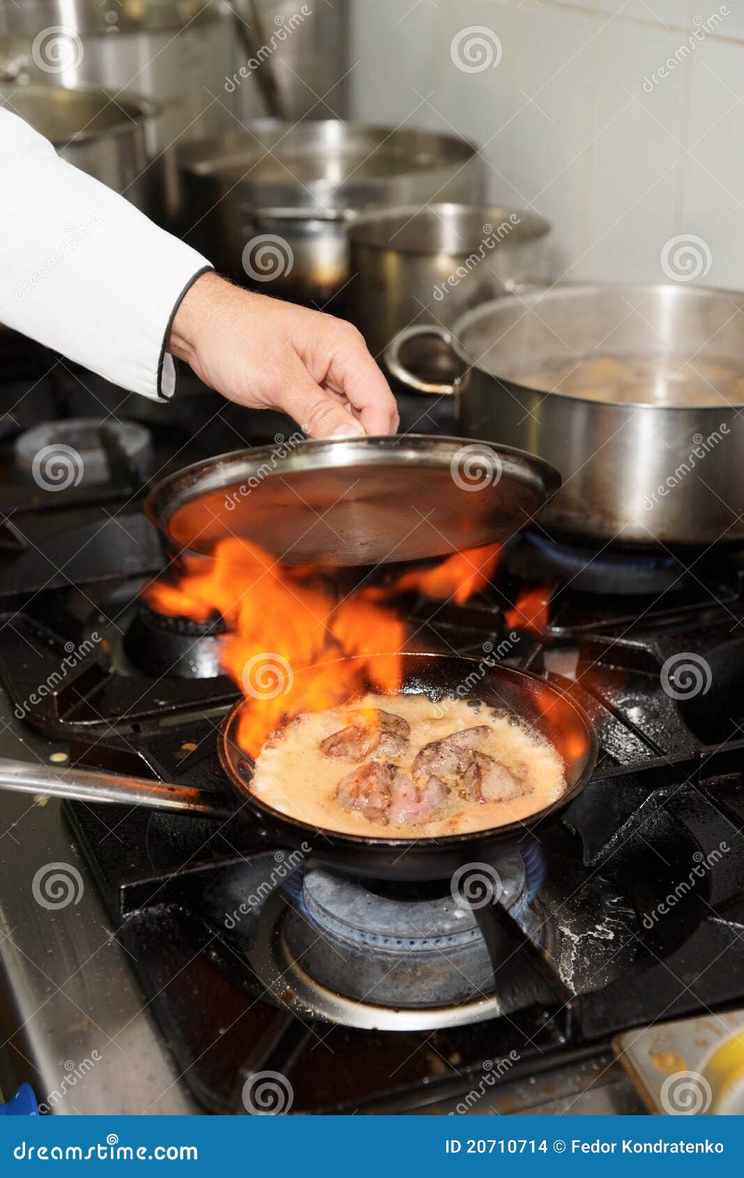 Chef is Making Flambe Dish on Restaurant Kitchen Stock Photo - Image of ...