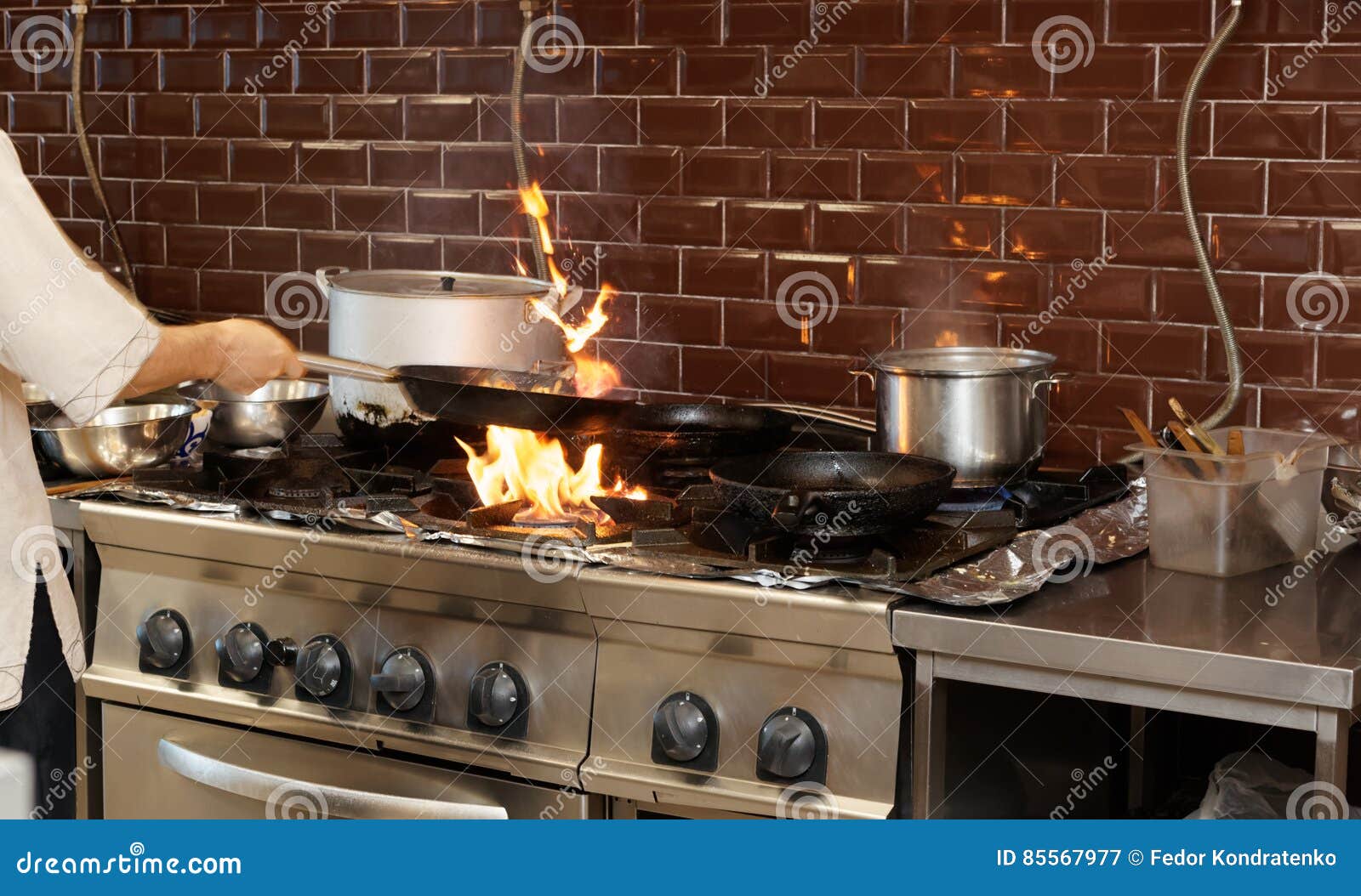Chef is making flambe dish stock image. Image of fire - 85567977