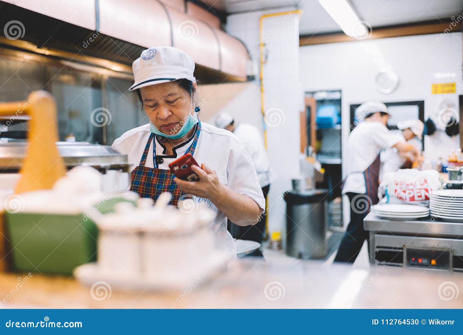 Chef making a phone call editorial image. Image of kitchen - 112764530