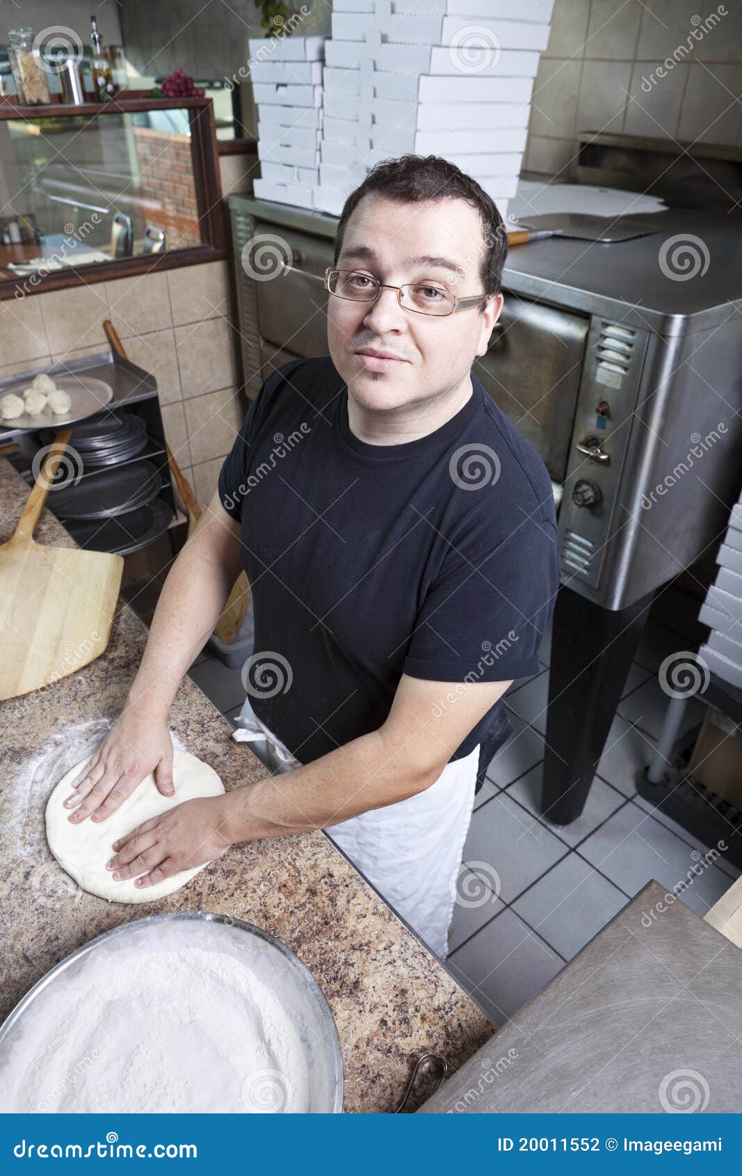Chef making a pizza stock photo. Image of ingredients - 20011552