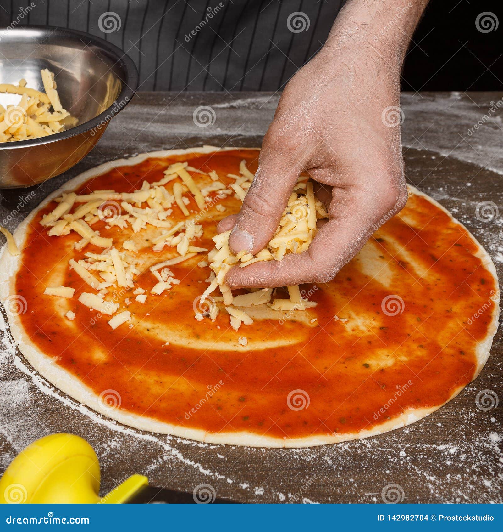 Chef Making the Pizza, Adding Cheese on Pizza Base Stock Photo - Image ...