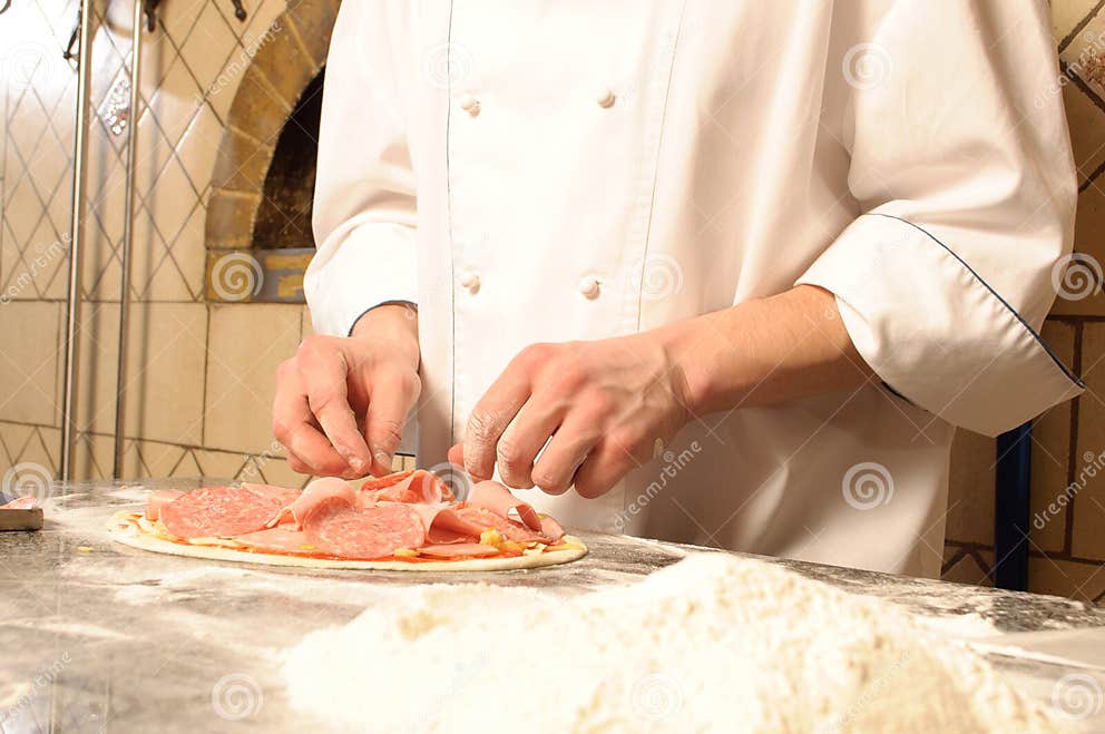 Chef making a Pizza Base stock photo. Image of person - 19437362
