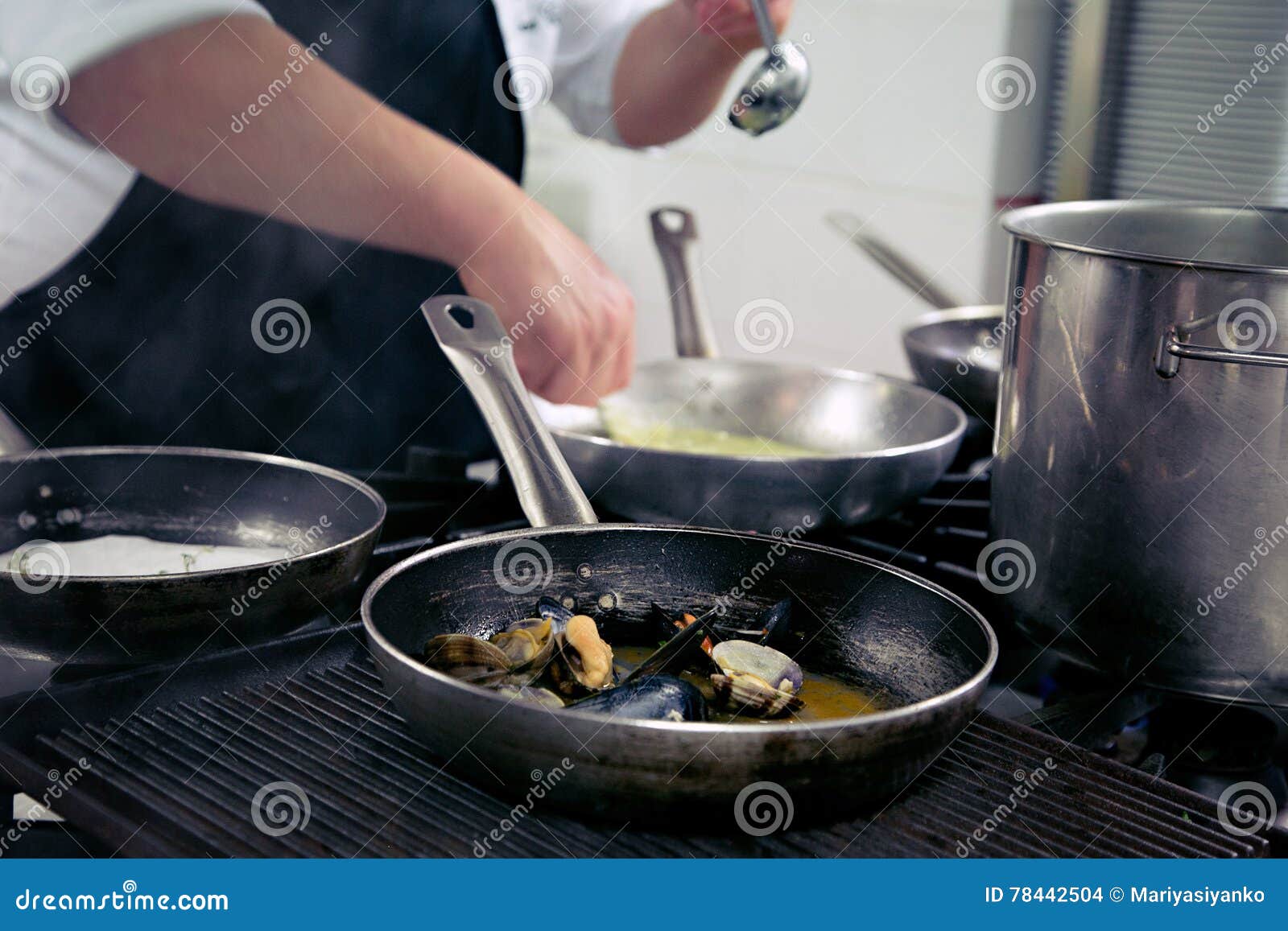 Chef is Making a Saute of Mussels Stock Photo - Image of hands ...