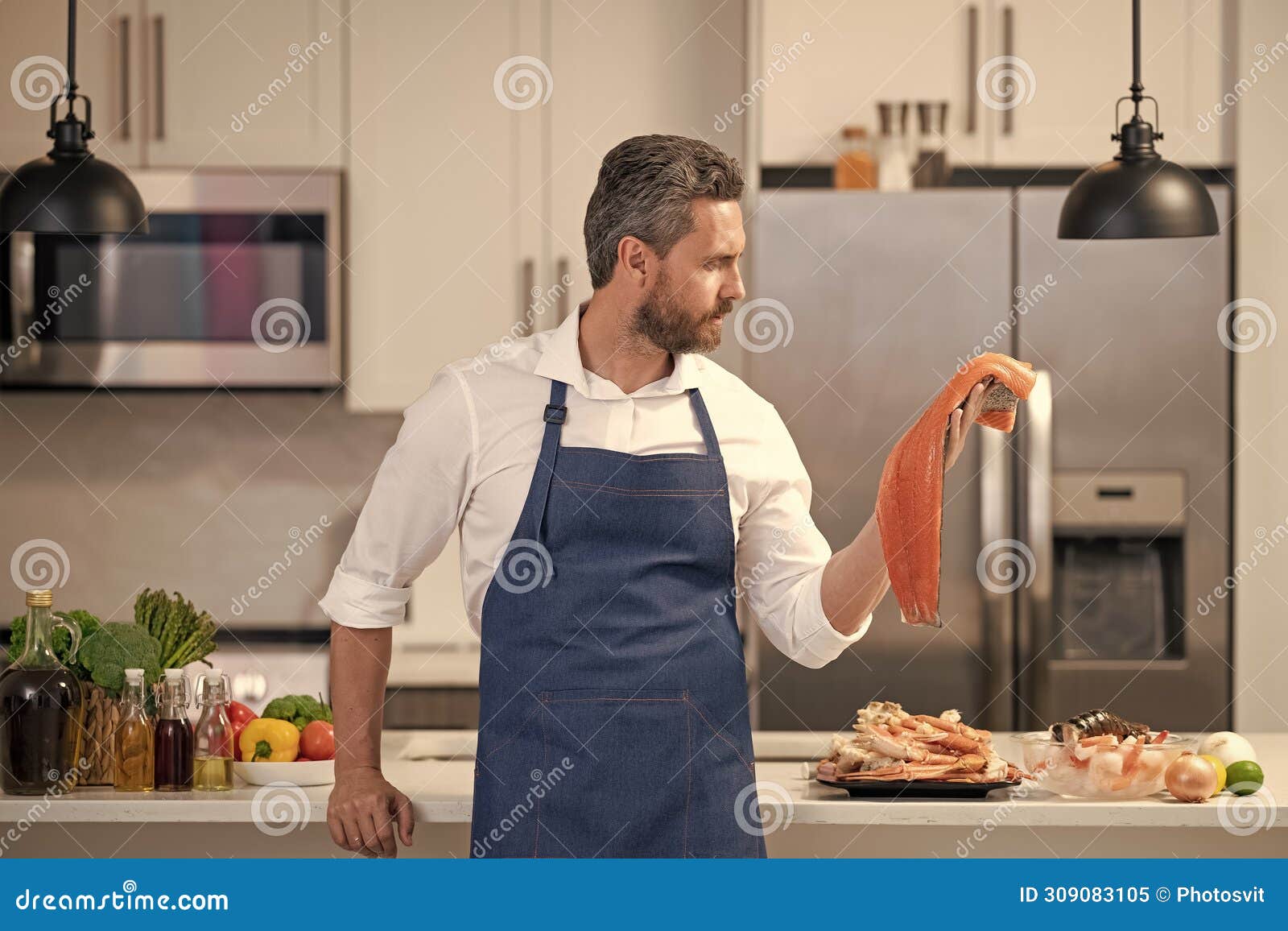 Chef Man Cooking Fish in the Restaurant Kitchen. Photo of Chef Man ...