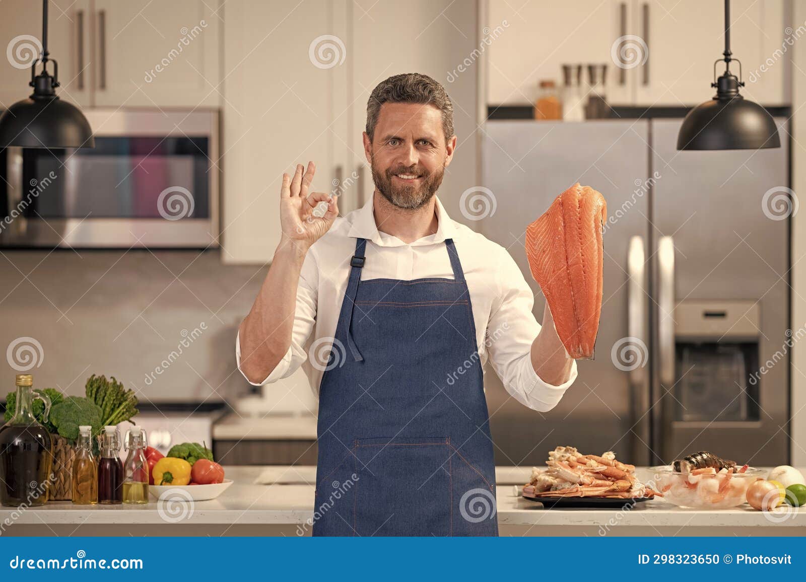 Chef Man Cooking Fish Salmon, Ok. Chef Man Cooking Fish in the Kitchen ...