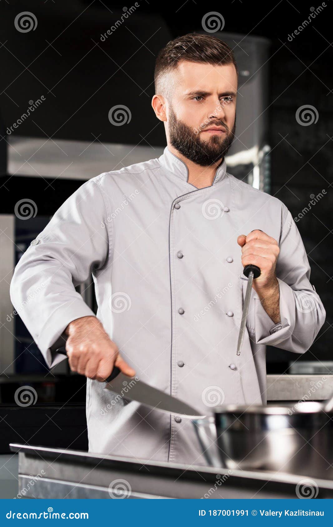 Chef Man with Knife at Kitchen Restaurant. Chef in Uniform Sharp Knife ...