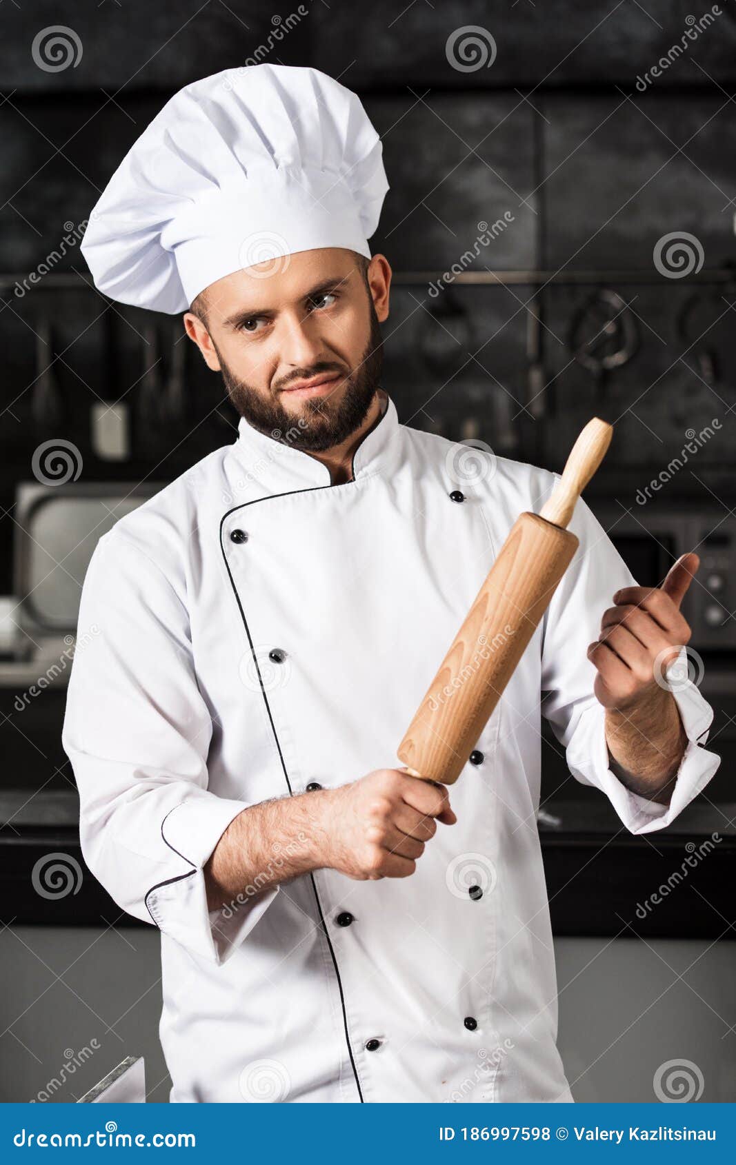 Chef Man with Roller at Kitchen Restaurant. Portrait of Chef with ...