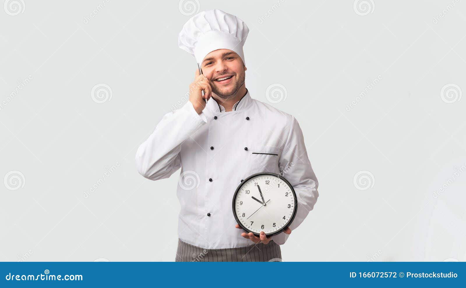 Chef Man Talking on Phone Holding Clock on White Background Stock Photo ...