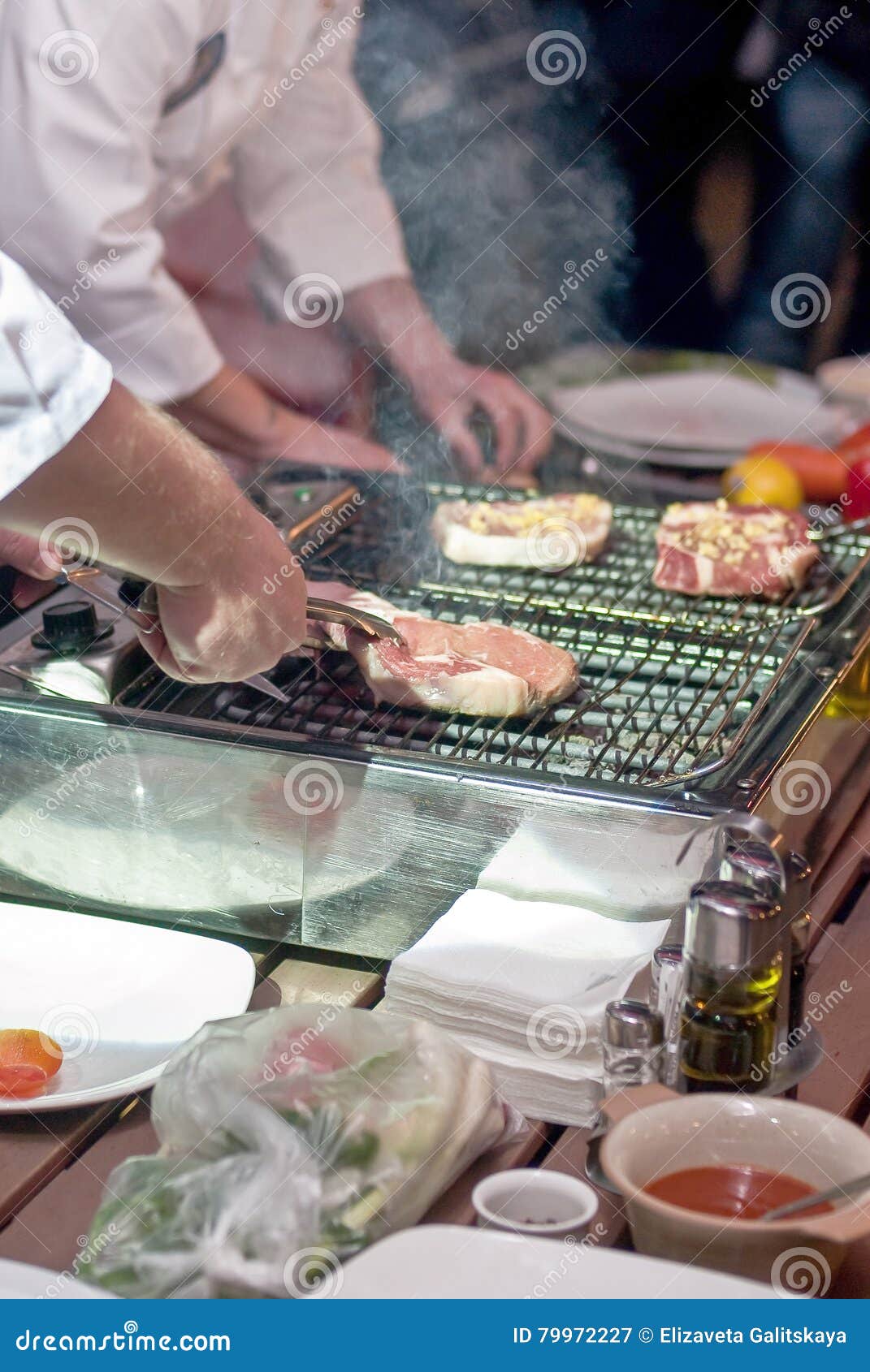 Chef Man In Uniform Frying A Meat Beefsteak Slice On Grill Royalty-Free ...