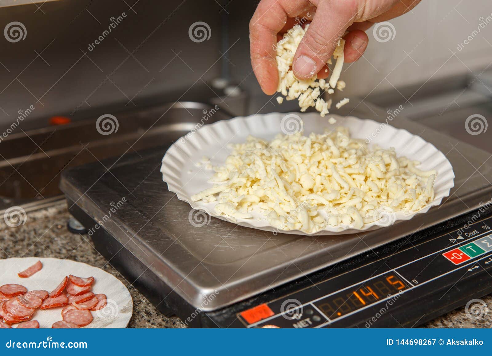 The Chef Measures on the Scales the Required Amount of Cheese for Pizza ...