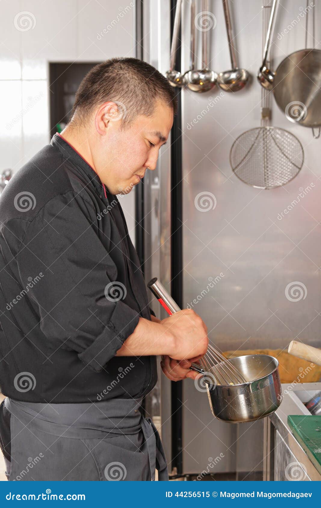 Chef mixes ingredients stock image. Image of utensils - 44256515