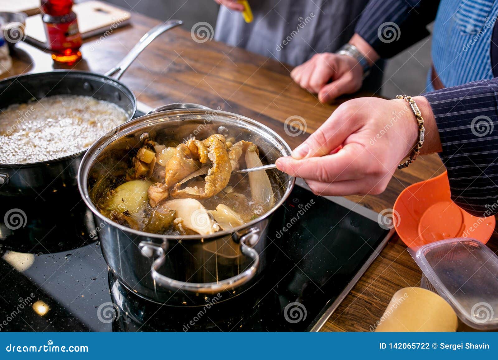 Chef Mixes Mushrooms In A Pan. Master Class In The Kitchen. The Process ...