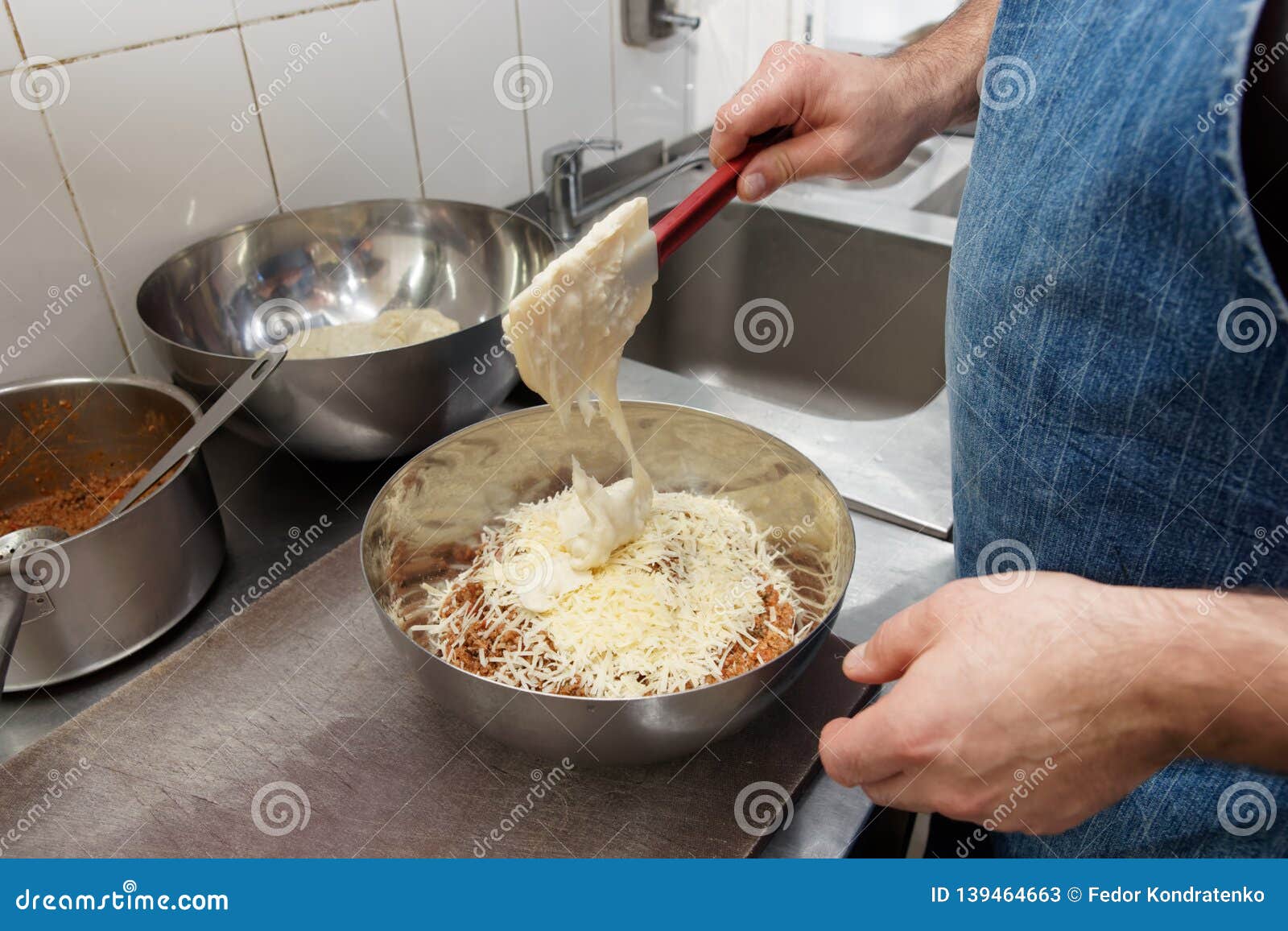 Chef is Mixing Ground Meat with Bechamel Sauce and Cheese Stock Image ...