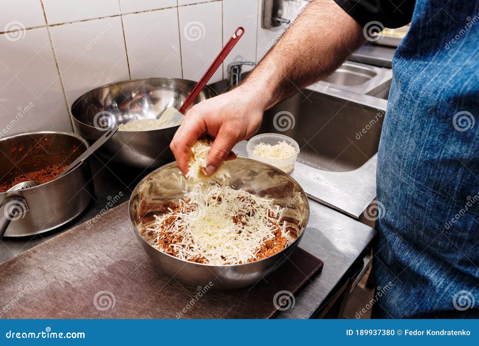 Chef is Mixing Ground Meat with Bechamel Sauce and Cheese Stock Photo ...