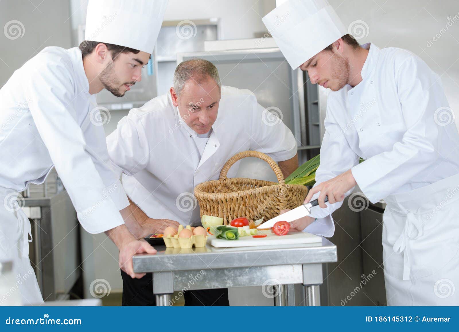 Chef Overseeing Trainees Prepping Vegetables Stock Photo - Image of ...