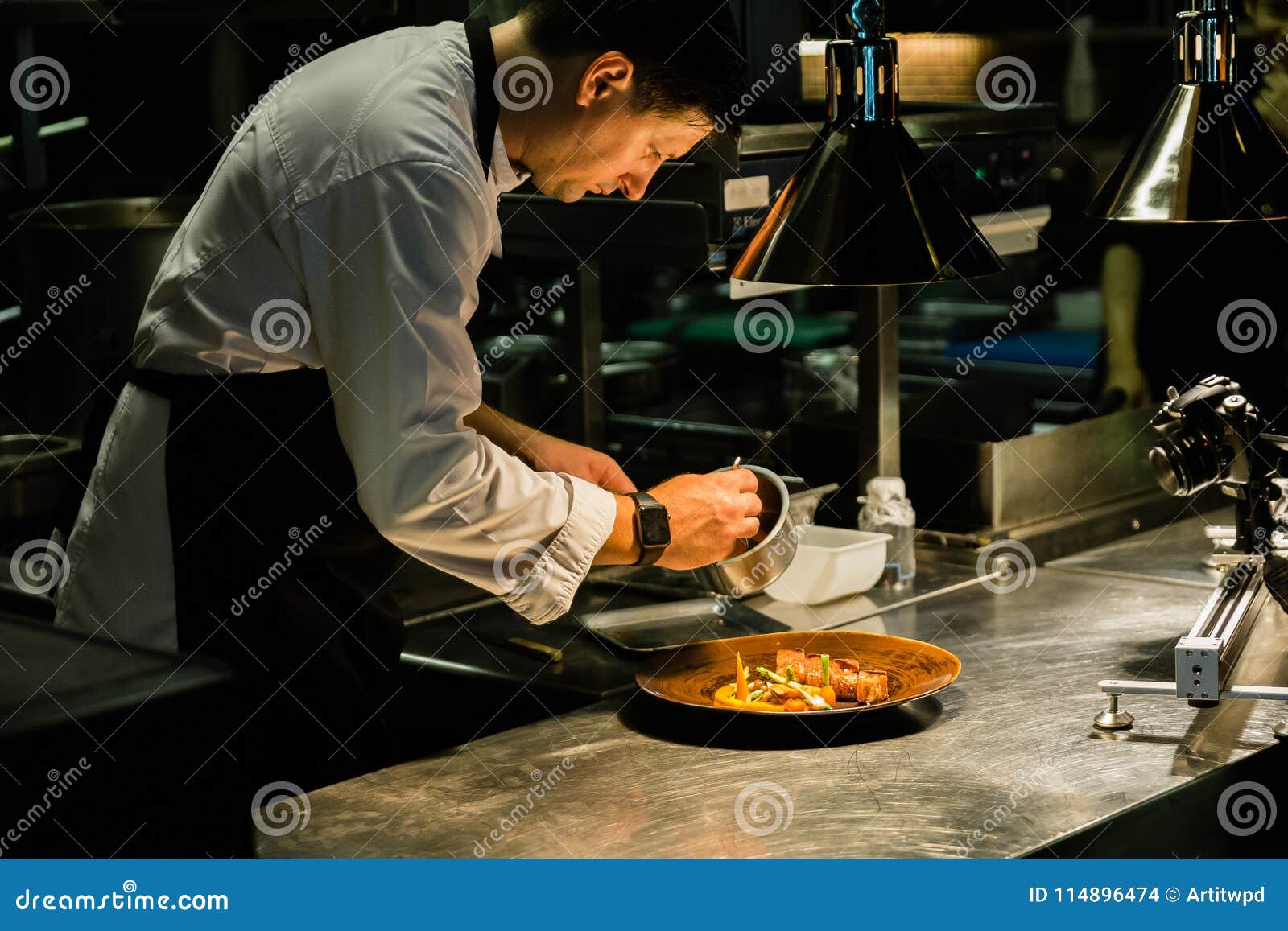 Chef Plating Dish on Kitchen Counter while Recording at Kitchen Hotel ...