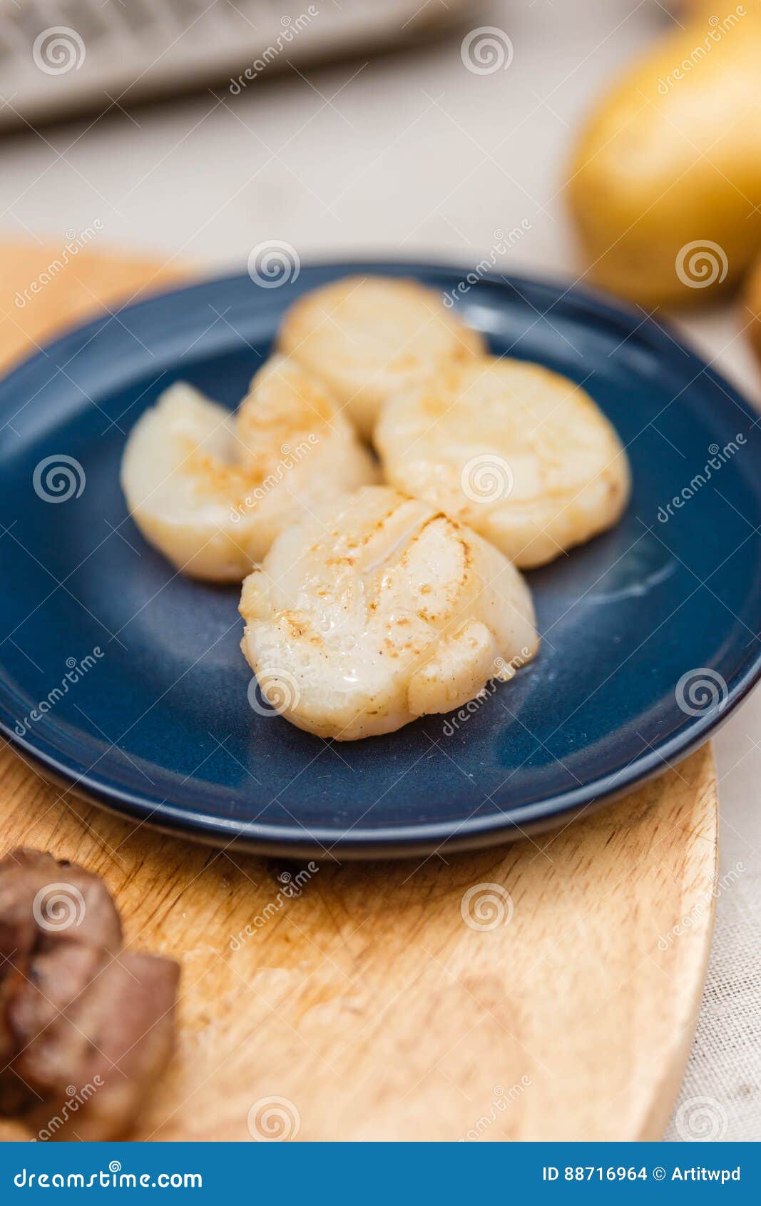 Chef Plating Fried Scallops in Blue Ceramic Plate Stock Photo - Image ...