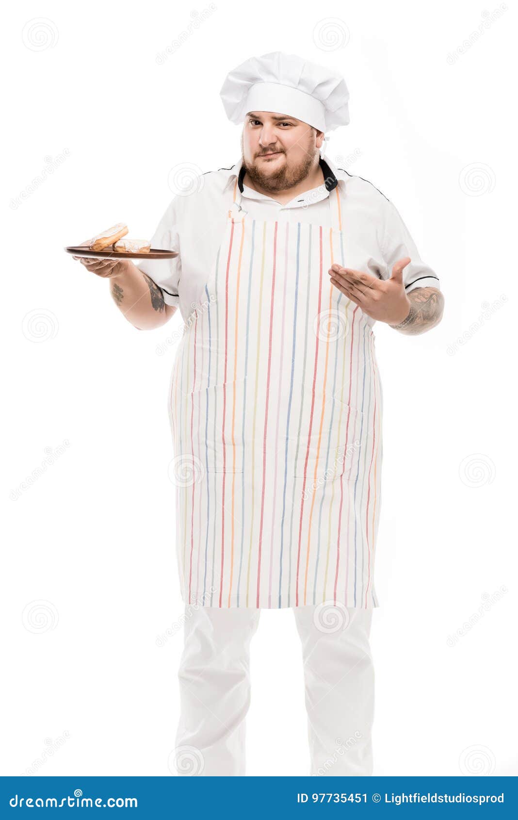 Chef Pointing at Sweet Doughnuts on Plate and Looking at Camera Stock ...