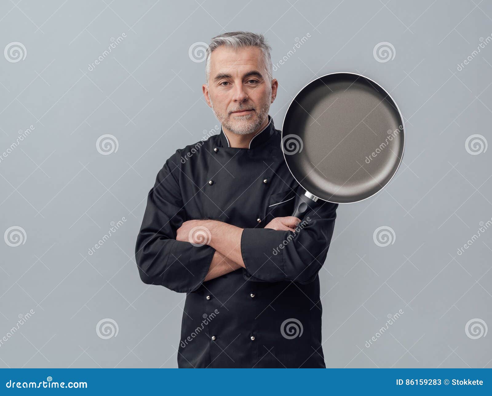 Chef posing with a pan stock image. Image of handsome - 86159283