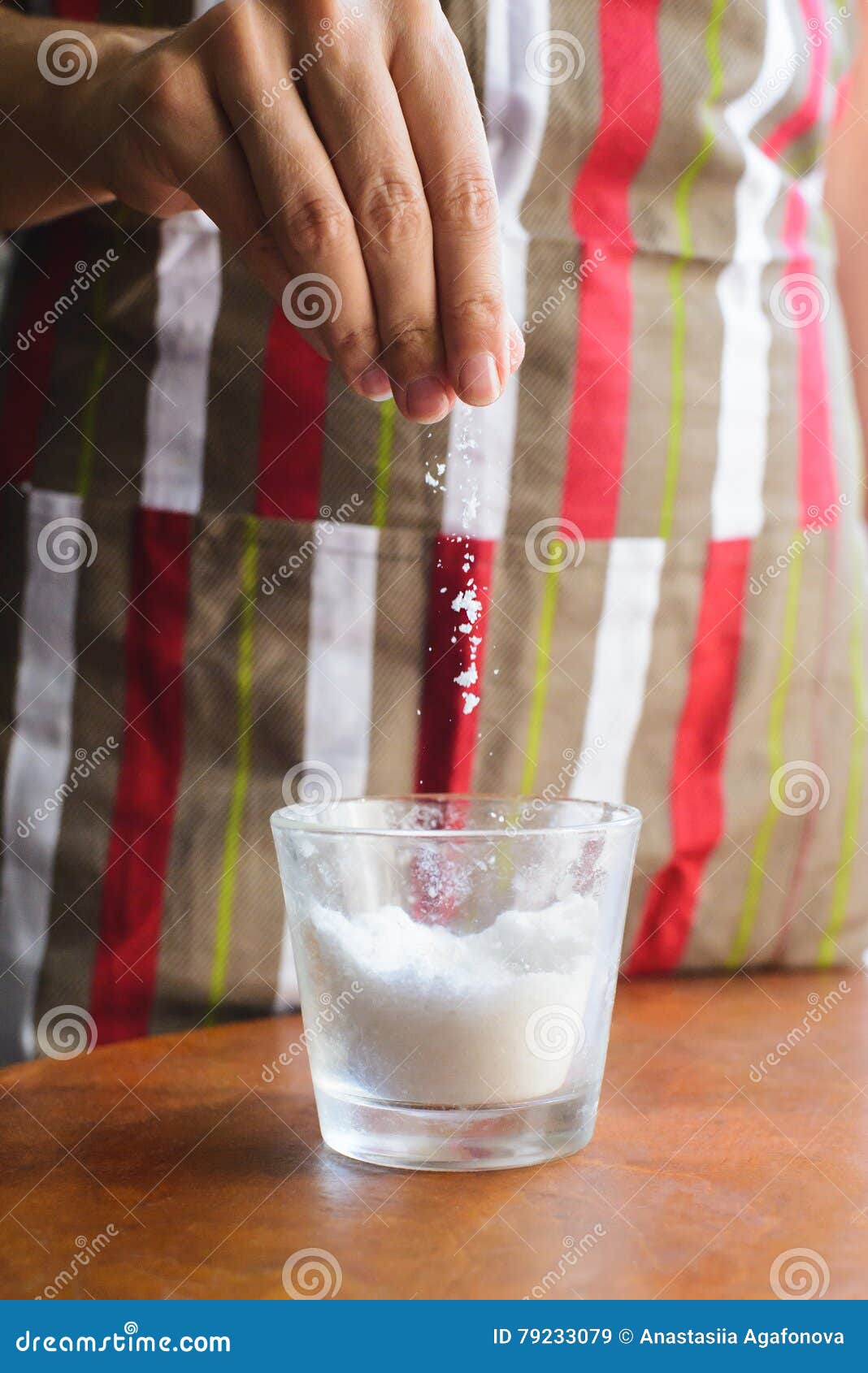 Chef pour salt in a glass stock image. Image of salt - 79233079