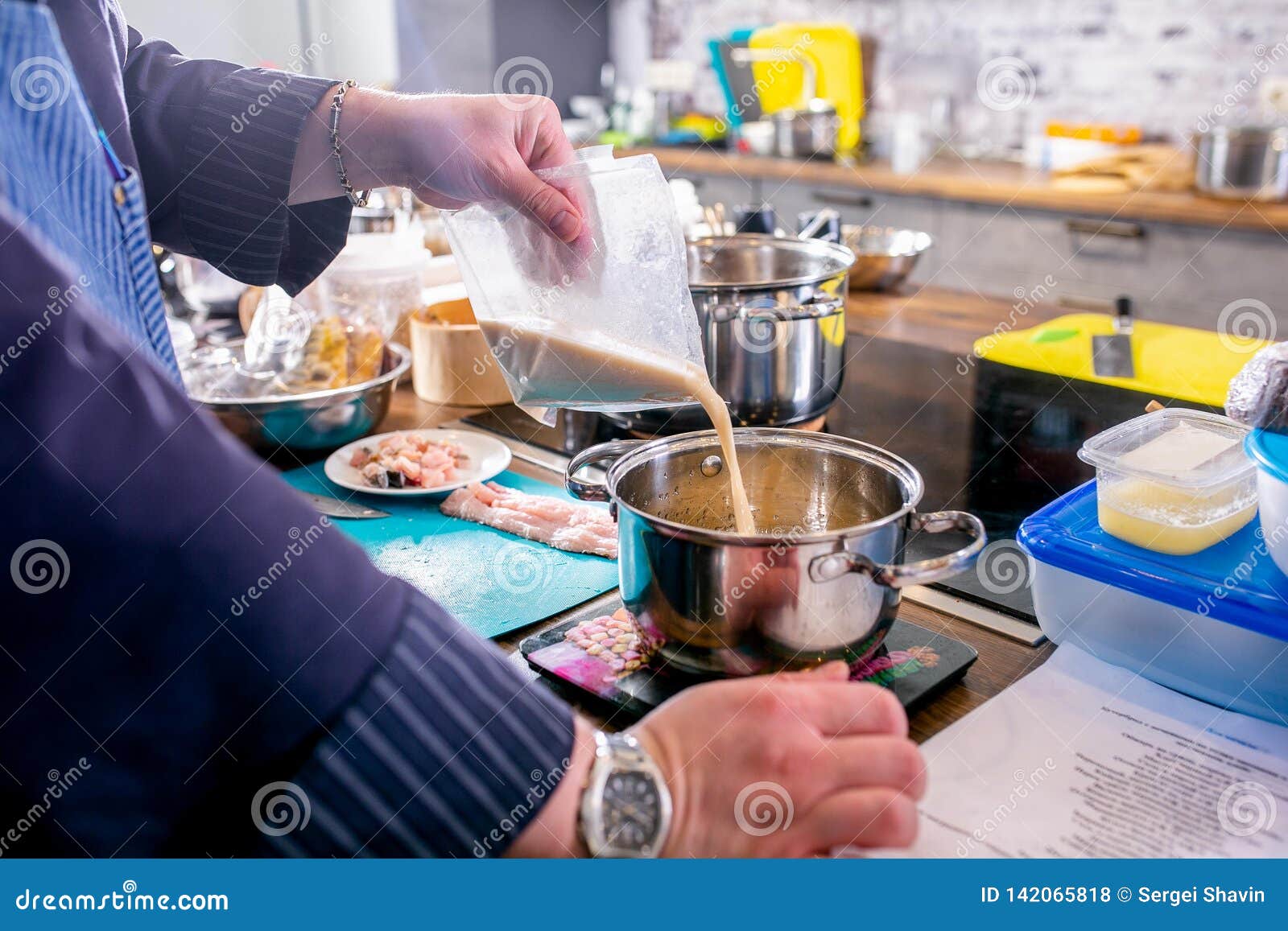 Chef Pours the Required Amount of Broth into the Pan, Which Stands on ...