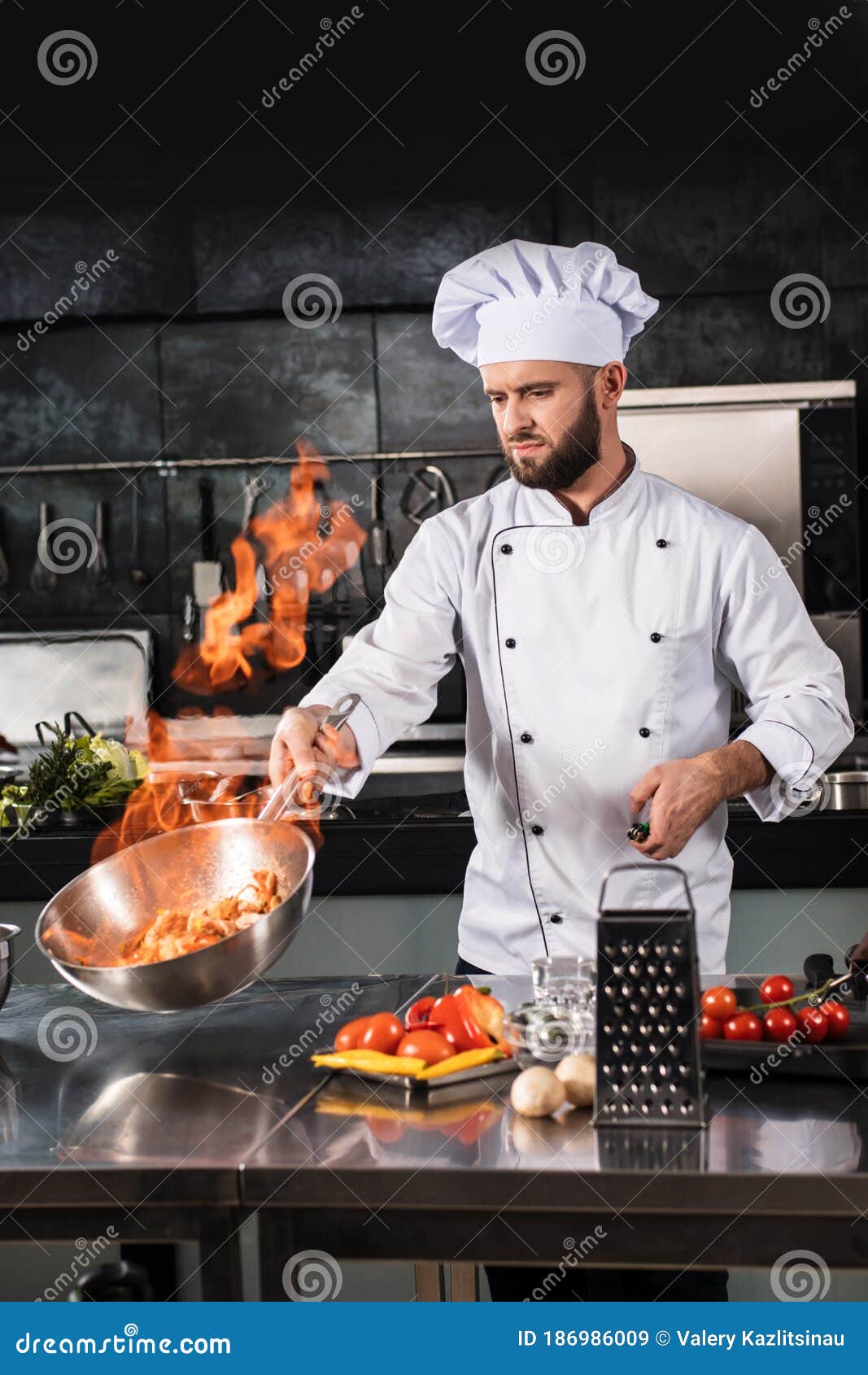 Chef Prepare Food with Fire at Kitchen Restaurant. Chef with Wok at ... Chef Prepare Food with Fire at Kitchen Restaurant. Chef with Wok at ...