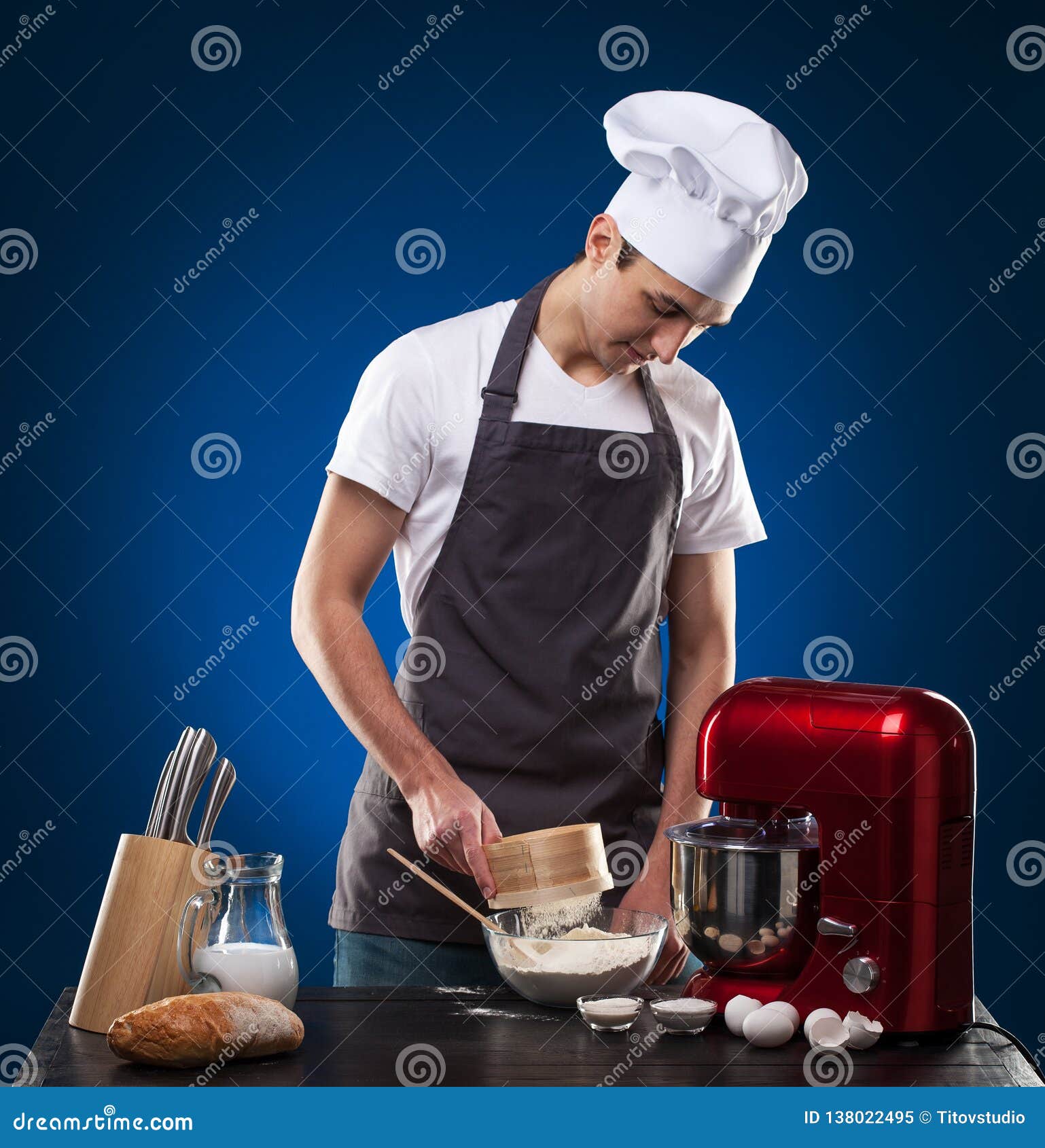 Chef Prepares a Delicious Dish on a Blue Background. Stock Image ...