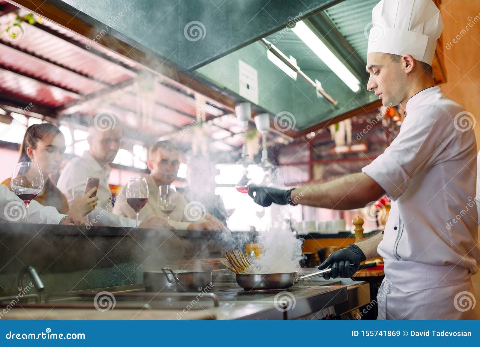 The Chef Prepares Food in Front of the Visitors in the Restaurant Stock ...