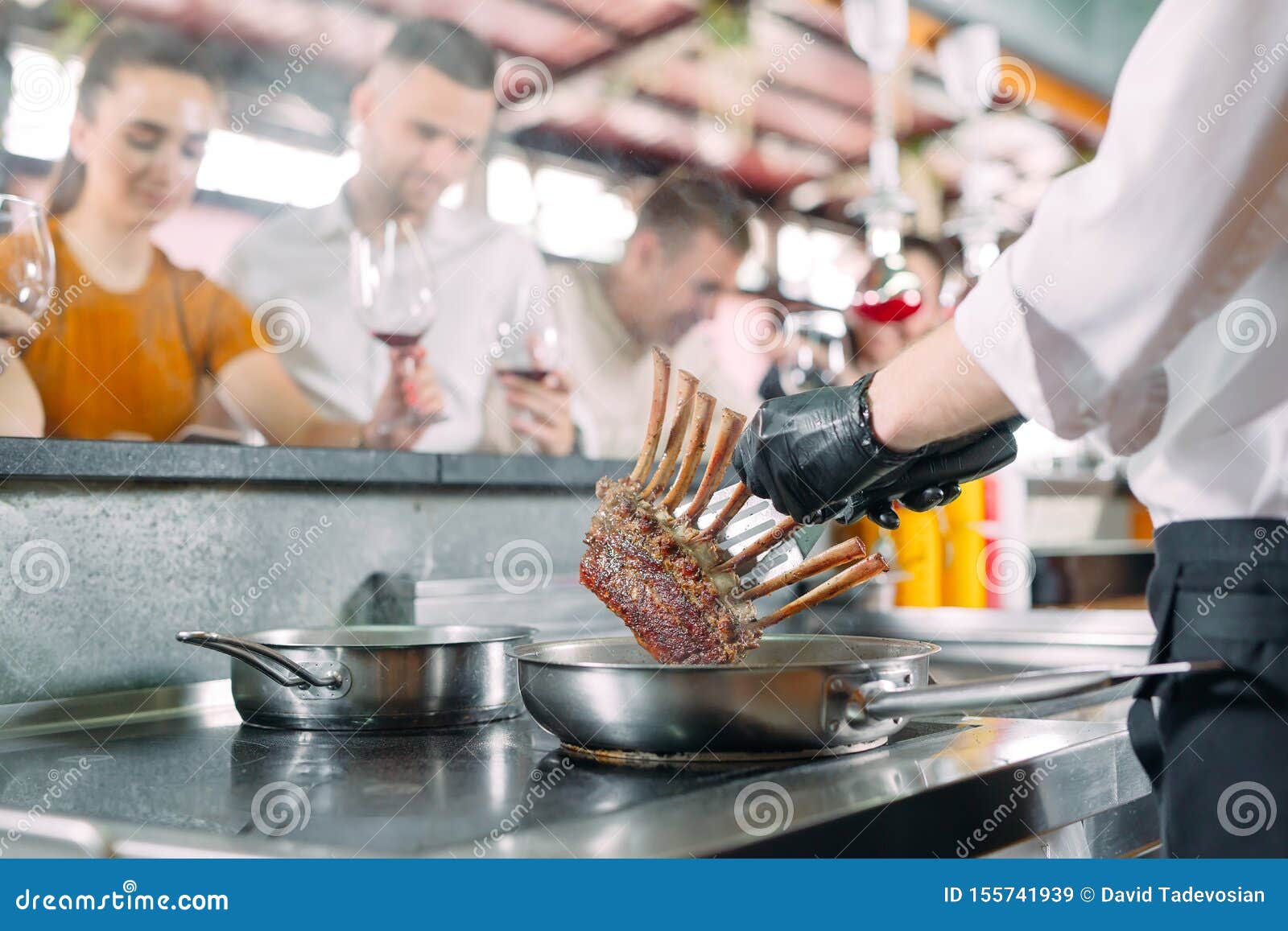 The Chef Prepares Food in Front of the Visitors in the Restaurant Stock ...