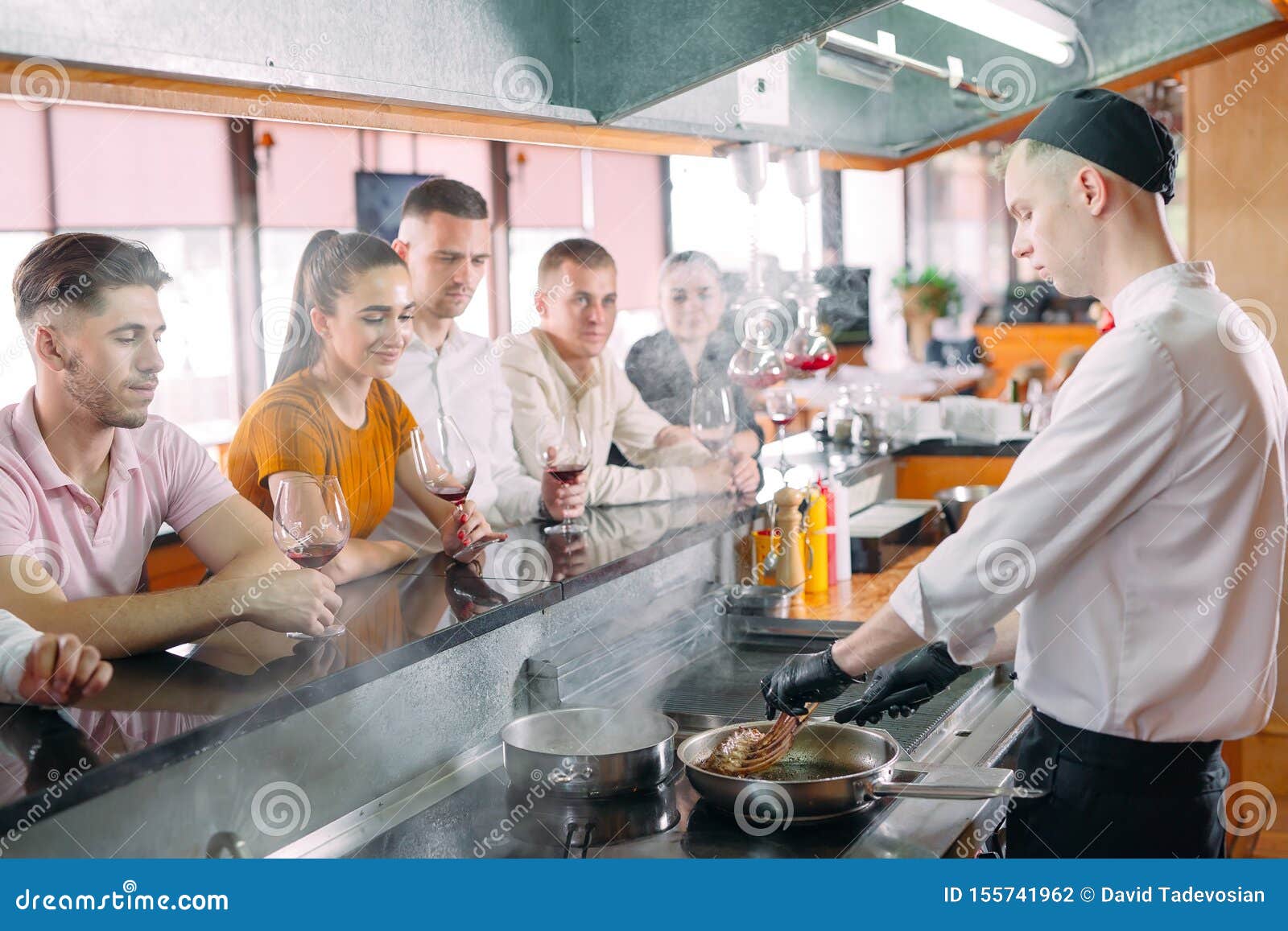 The Chef Prepares Food in Front of the Visitors in the Restaurant Stock ...