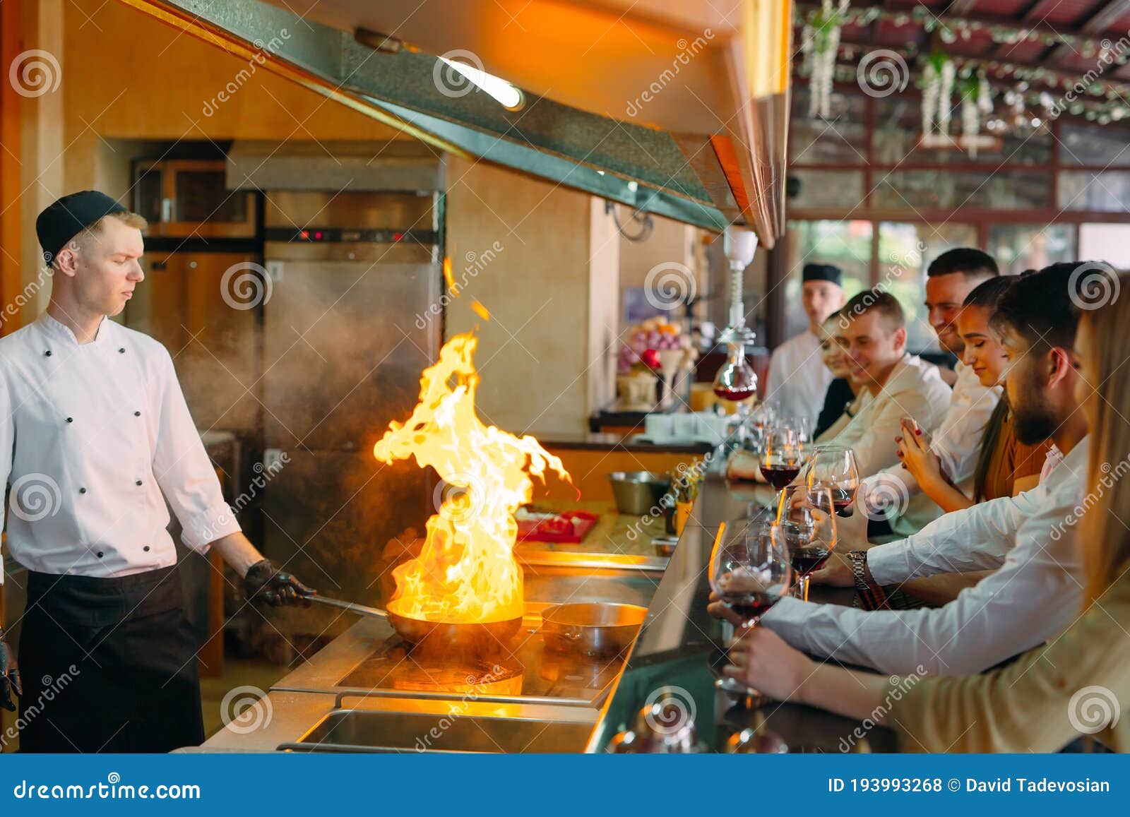 The Chef Prepares Food in Front of the Visitors in the Restaurant Stock ...