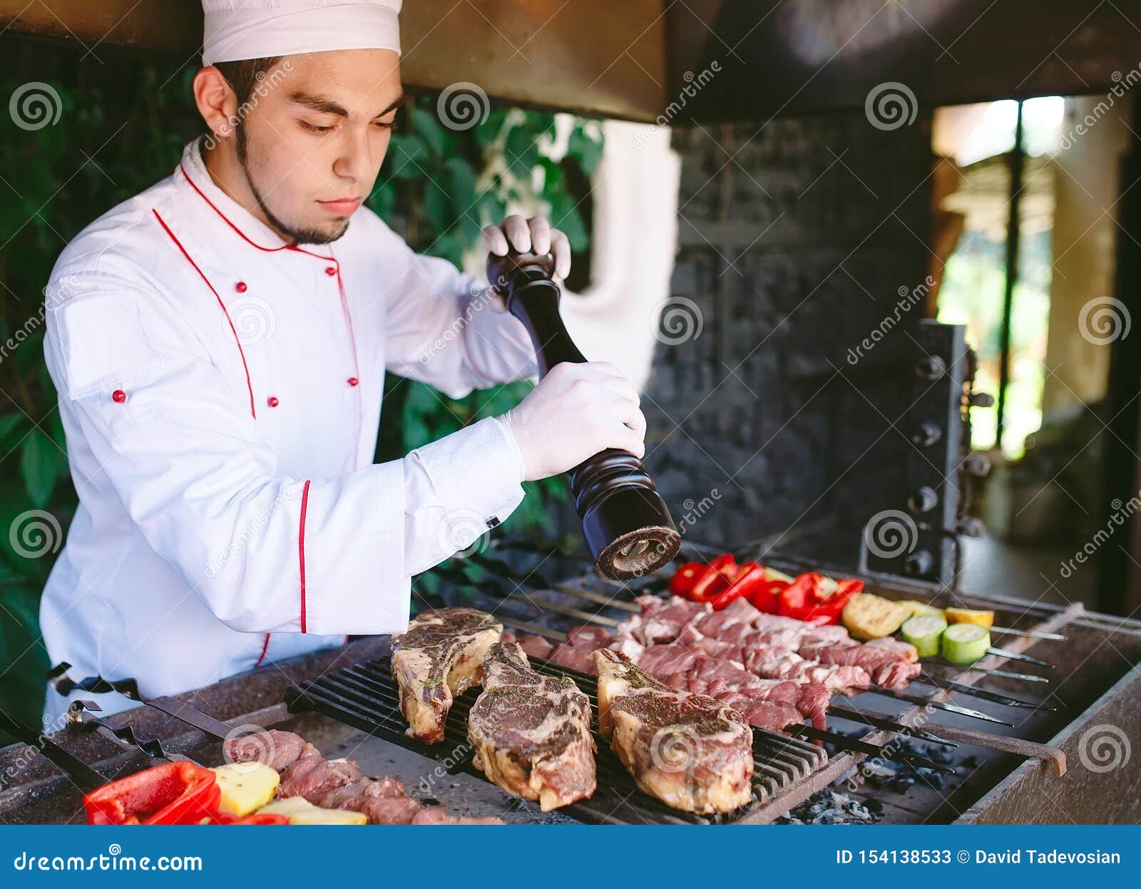 The Chef Prepares Meat on the Barbecue. Stock Image - Image of ...