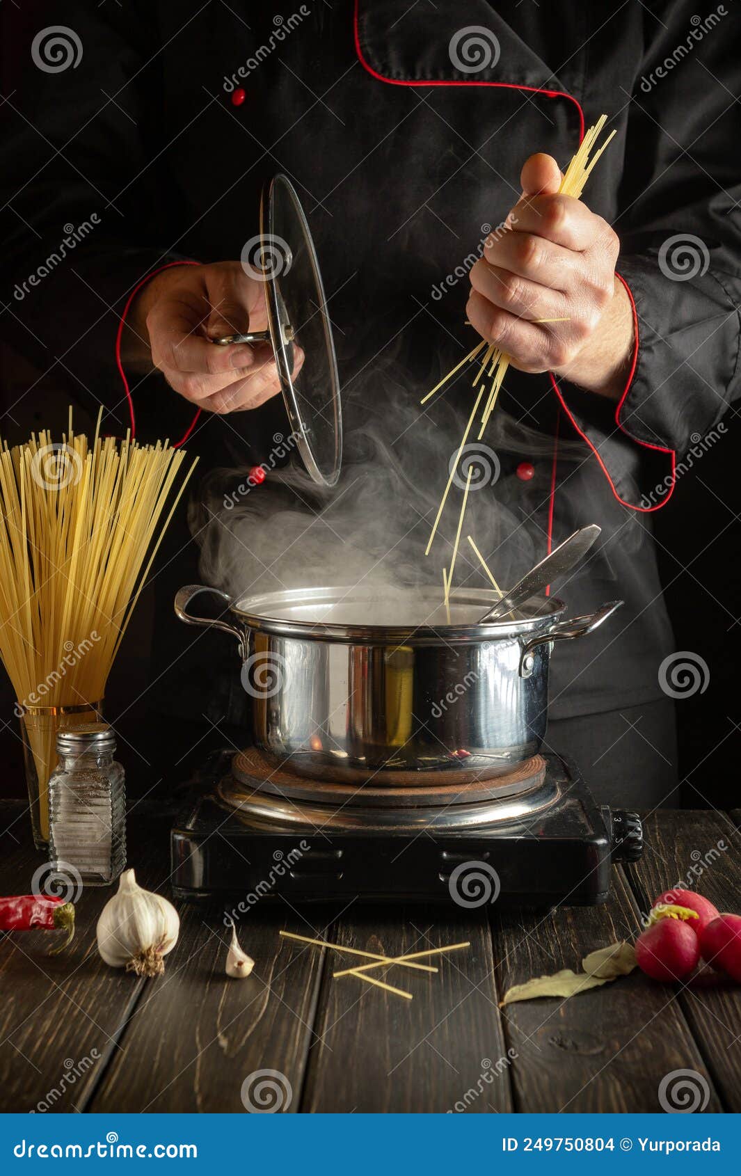 The Chef Prepares Spaghetti in a Pot in the Kitchen. Menu or Recipe ...