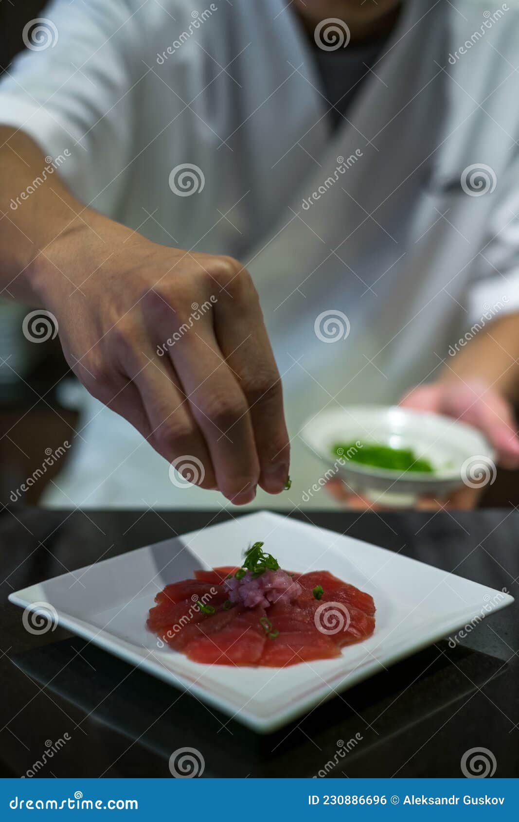The Chef Prepares Tuna Sashimi. the Process of Making and Decorating ...