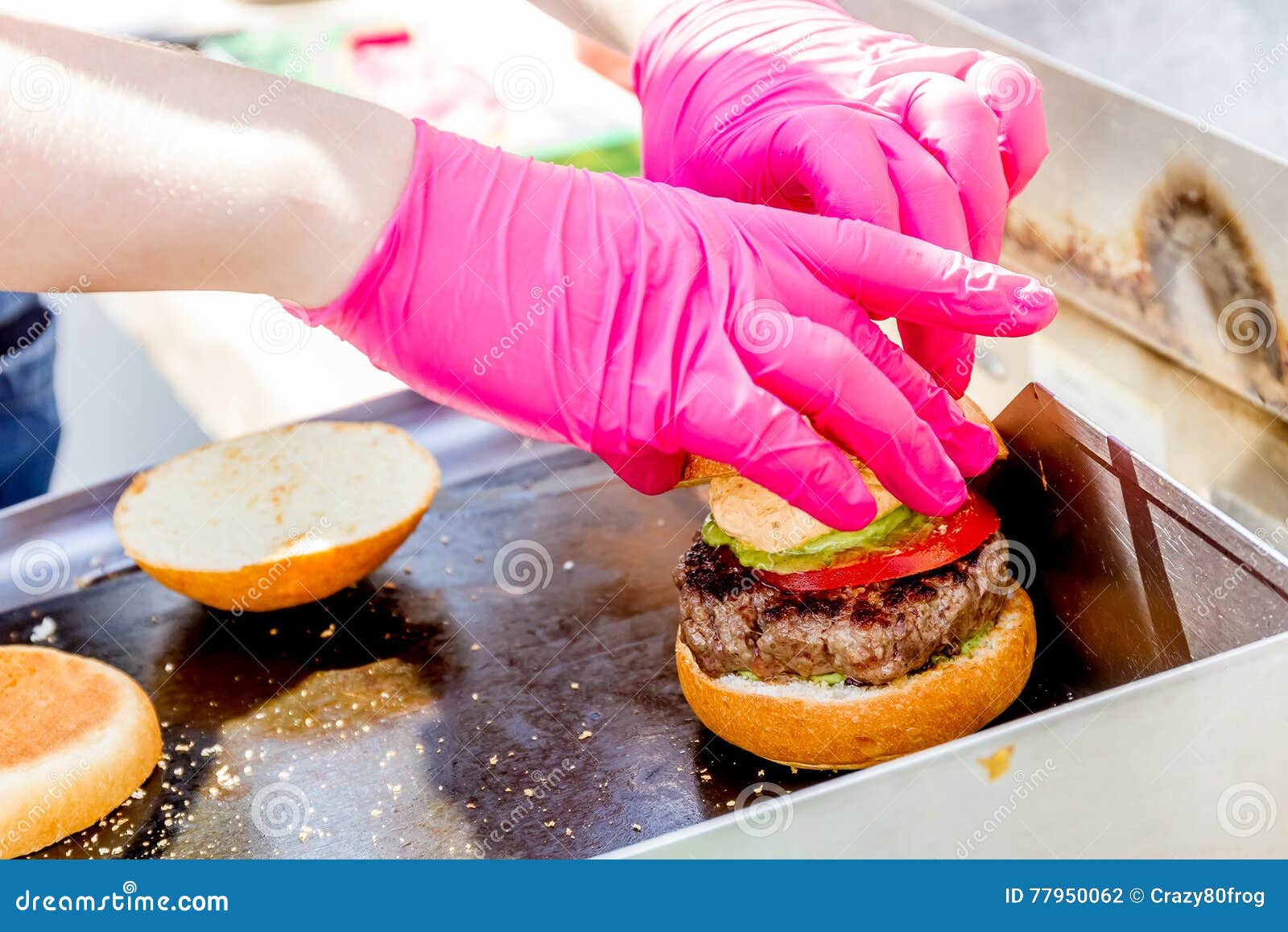 Chef preparing a burger stock photo. Image of bistro - 77950062