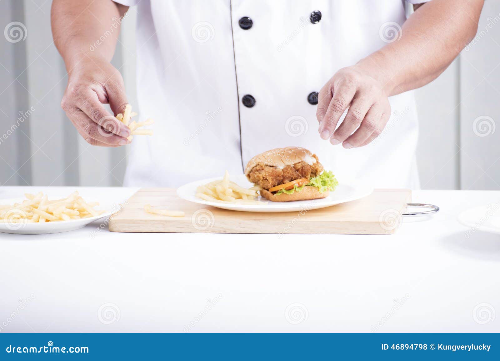 Chef preparing a burger stock photo. Image of preparation - 46894798