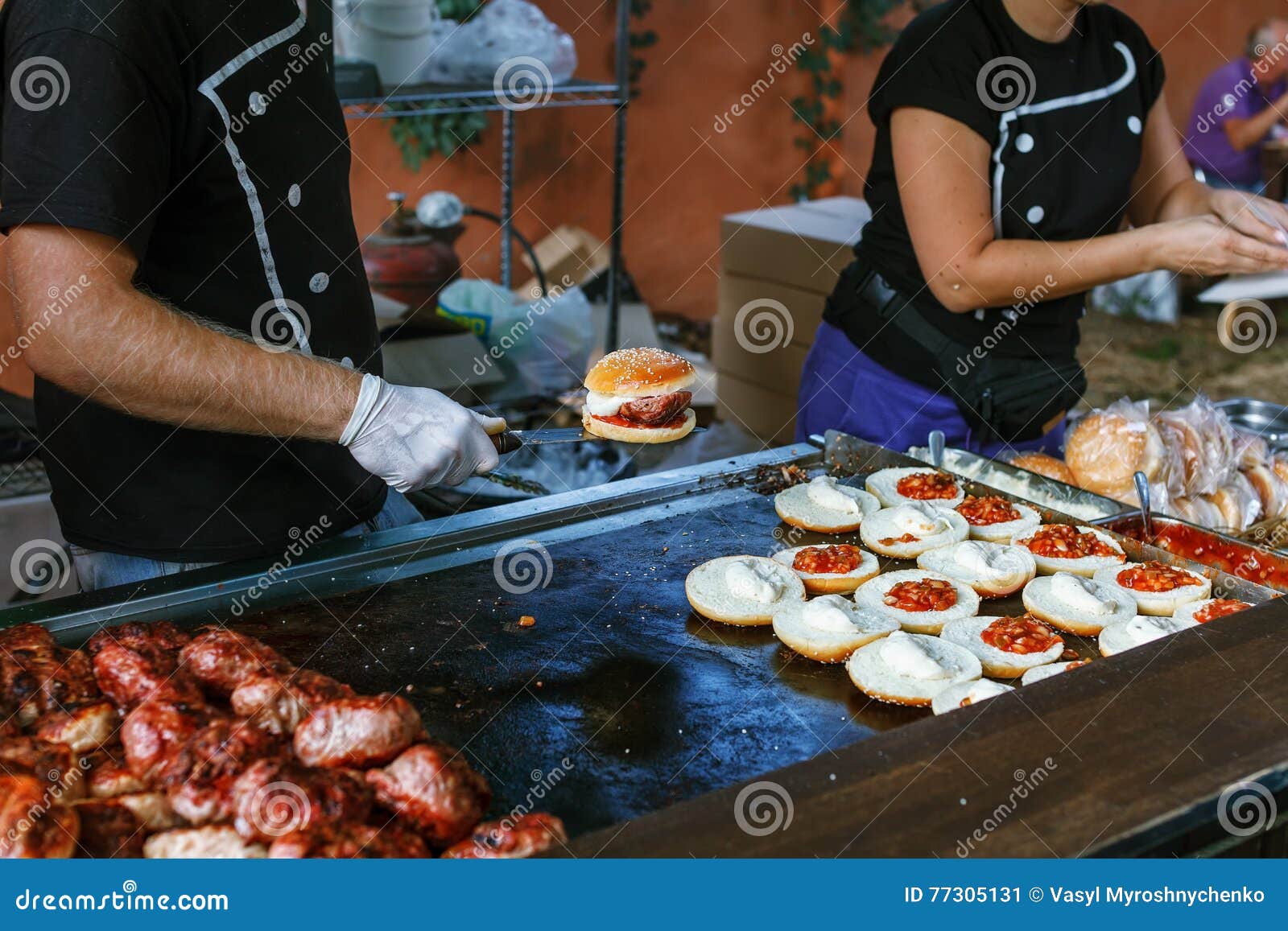Chef Preparing Burgers at the Barbecue Outdoors Stock Image - Image of ...