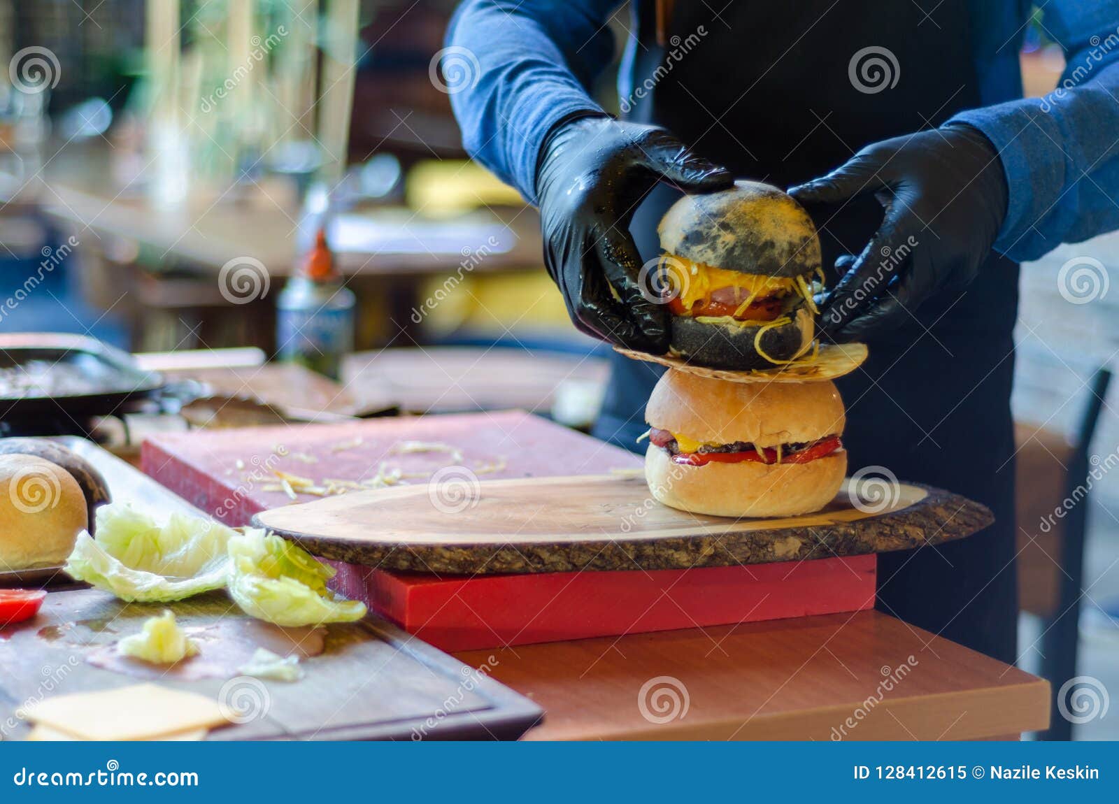 The Chef is Preparing His Burgers for Service. Stock Image - Image of ...
