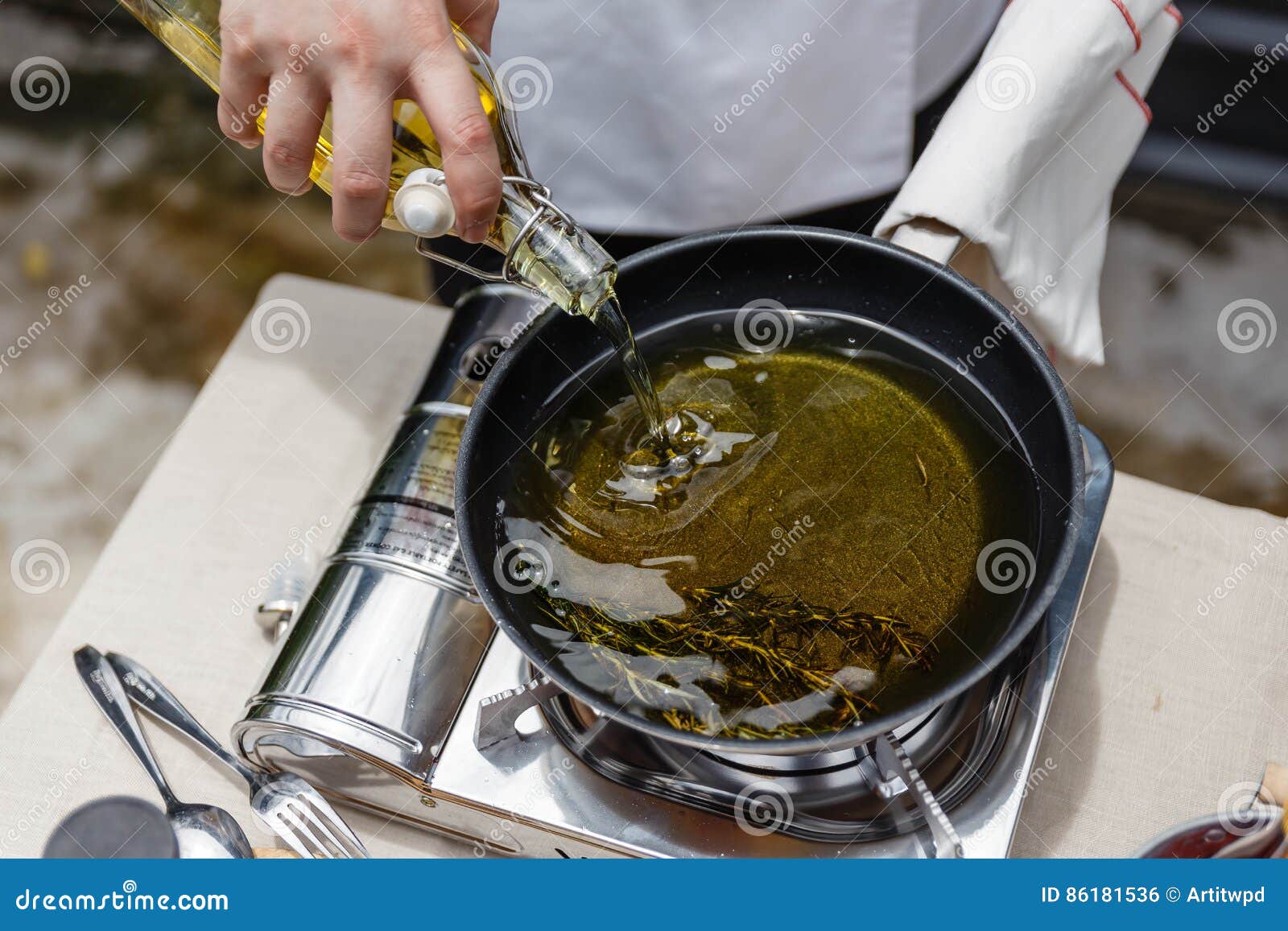 Chef Preparing Olive Oil In A Pan For Making Rosemary Oil Stock Photo ...