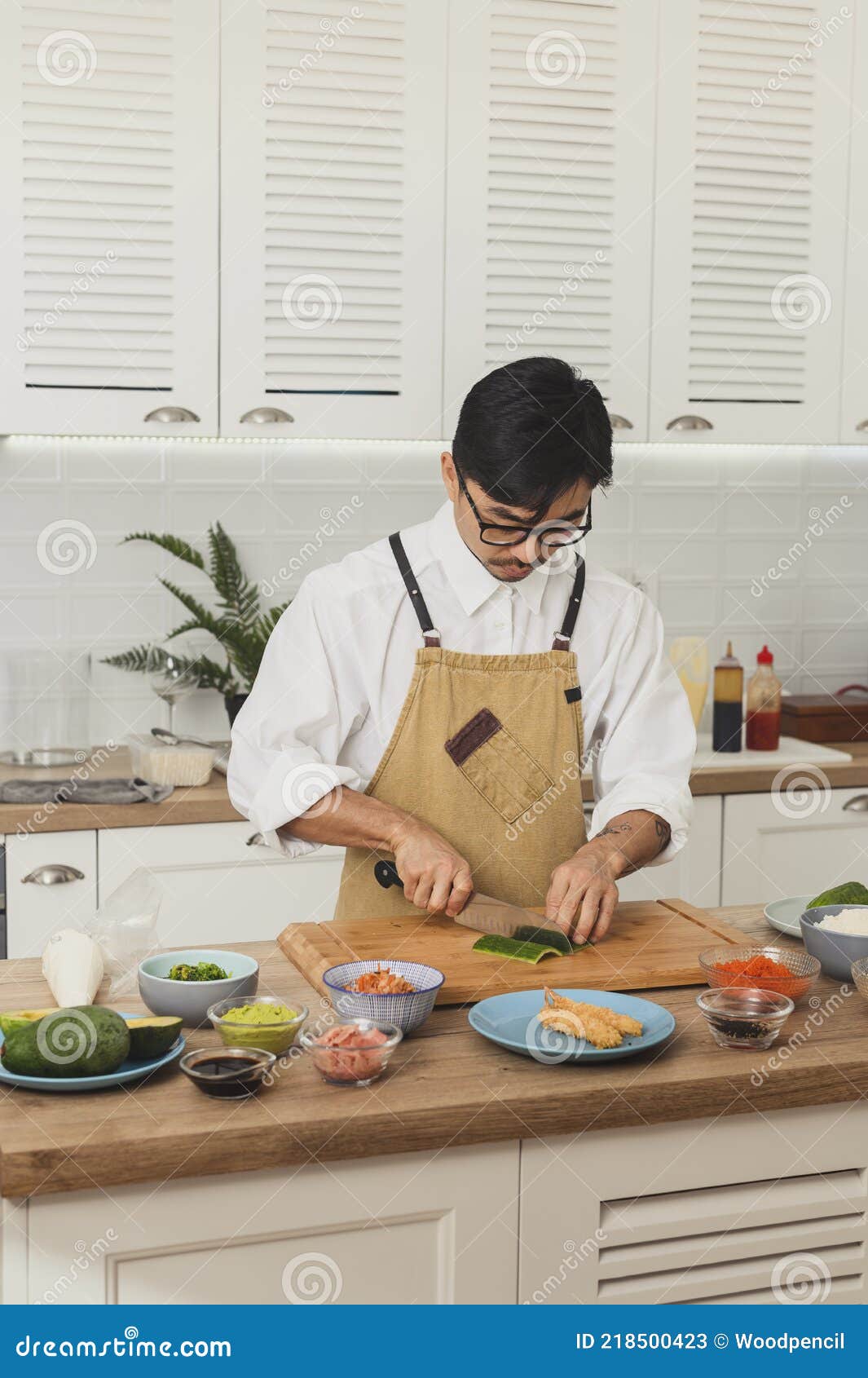 Chef Preparing Sushi. Asian Master Chef in Uniform Slicing Ingredients ...