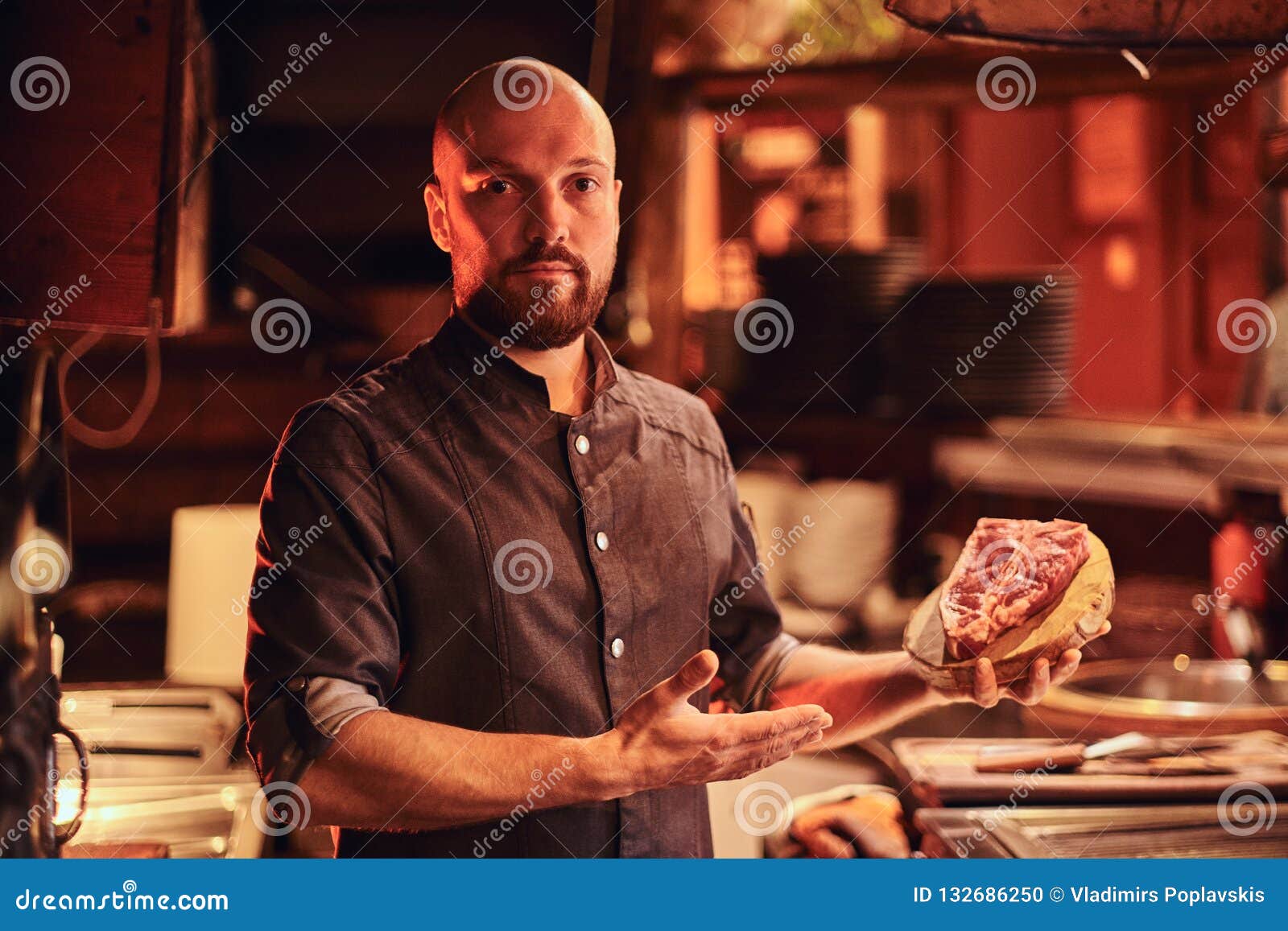 Chef Presenting a Fresh Steak before Cooking and Looking at a Camera in ...