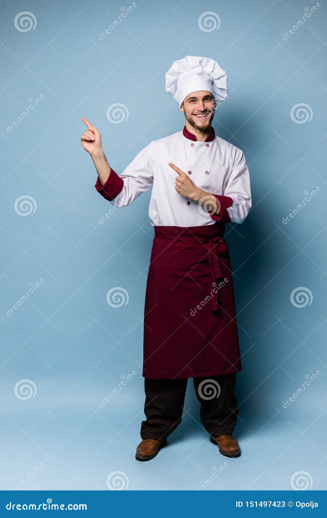 Chef Presenting Something Over Light Blue Background Stock Image ...