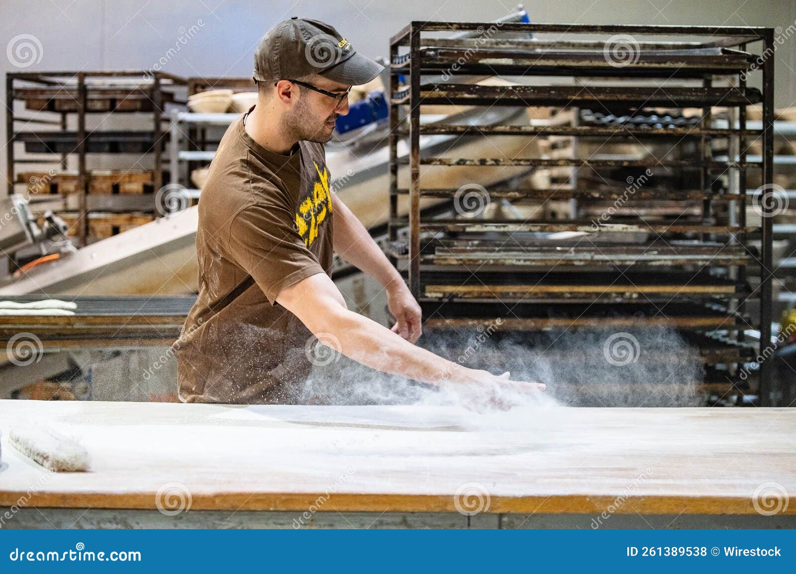 Chef Putting Flour on the Table for the Bread Cooking in the Kitchen of ...