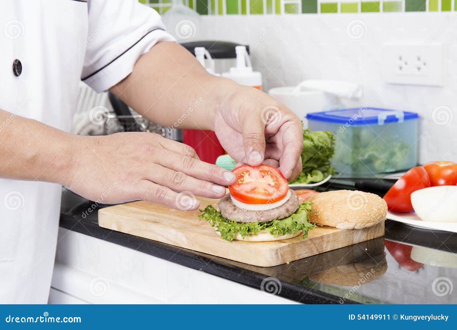 Chef Putting Slice of Tomato on the Hamburger Bun Stock Image - Image ...