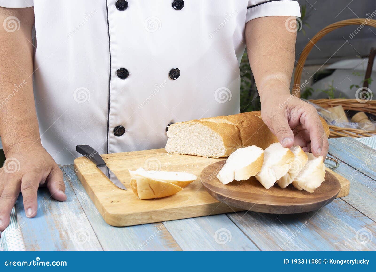 Chef Putting Slide Bread on the Plate Stock Photo - Image of flour ...
