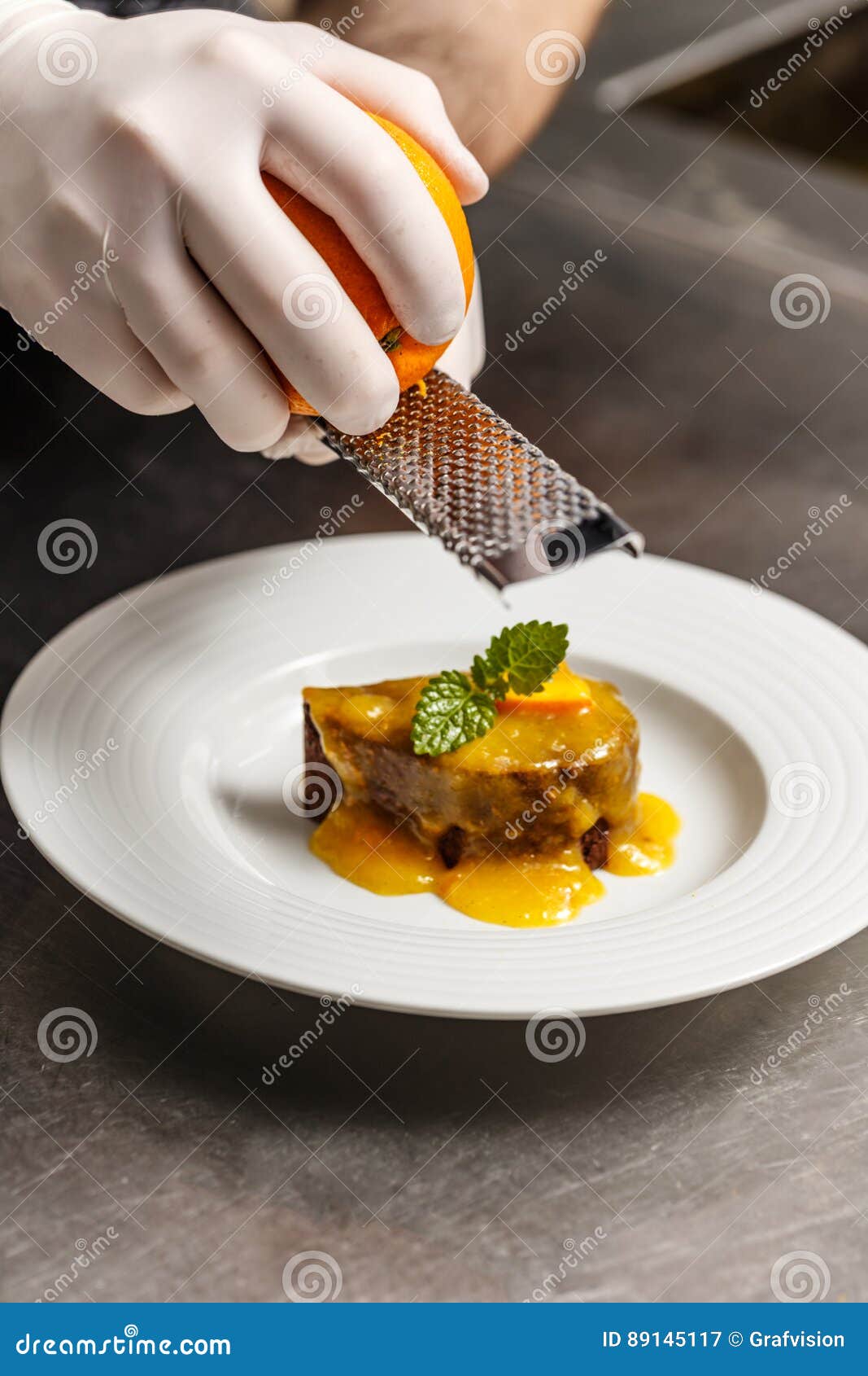 Chef rasping orange zest stock image. Image of patisserie - 89145117