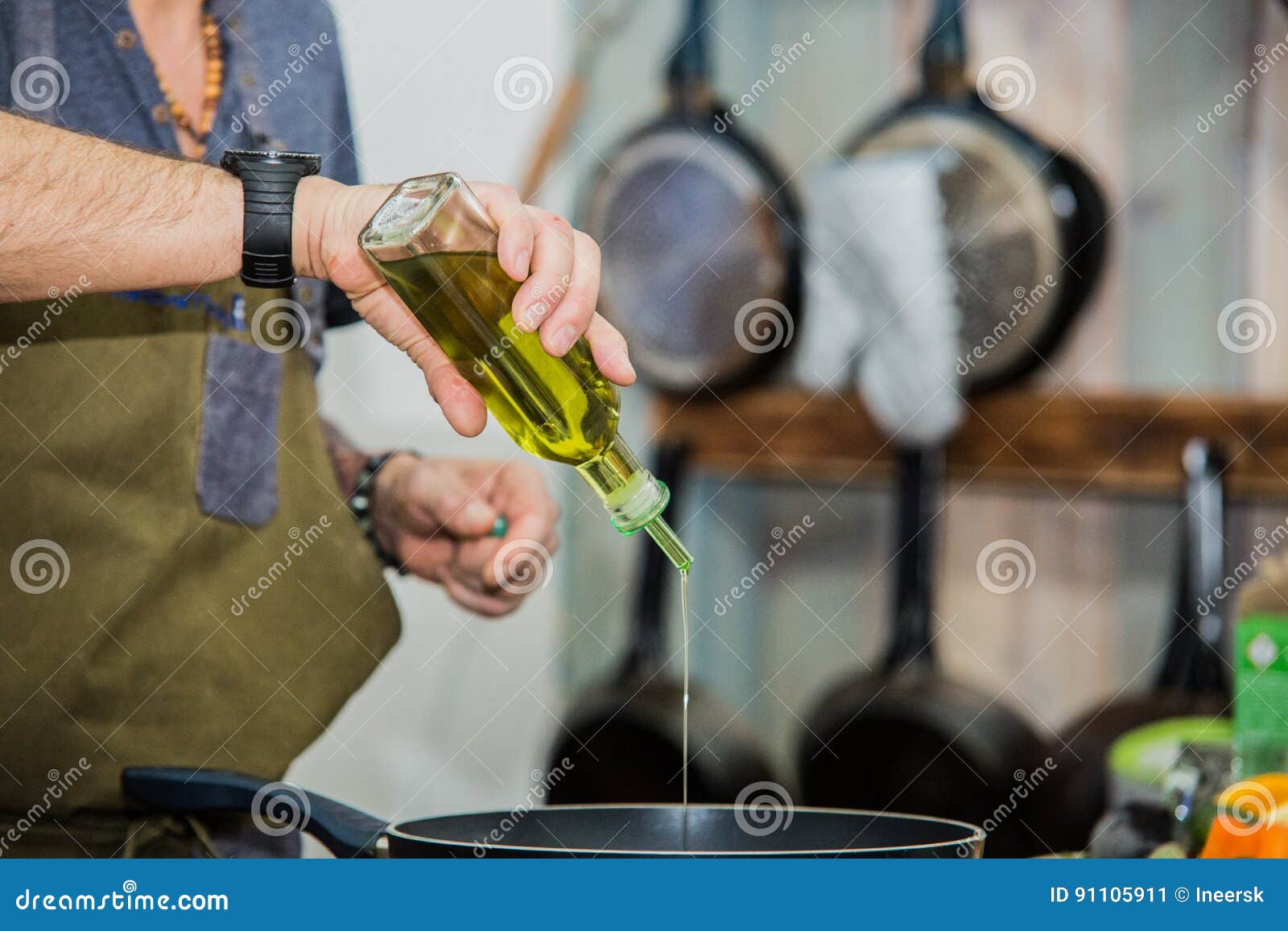 Chef in Restaurant Kitchen at Stove with Pan Adding Oil Stock Image ...
