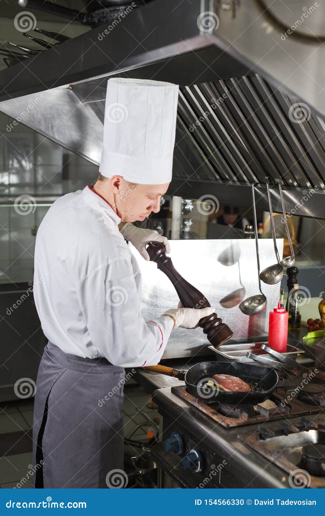 Chef in Restaurant Kitchen at Stove with Pan, Cooking Stock Photo ...