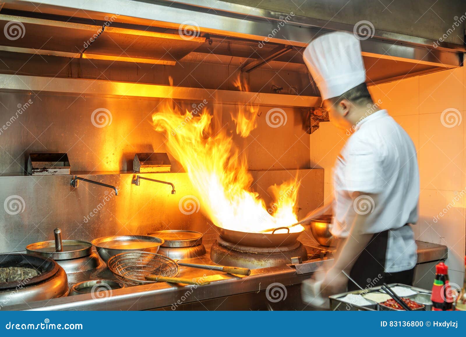 Chef in Restaurant Kitchen at Stove with Pan Stock Photo - Image of ...