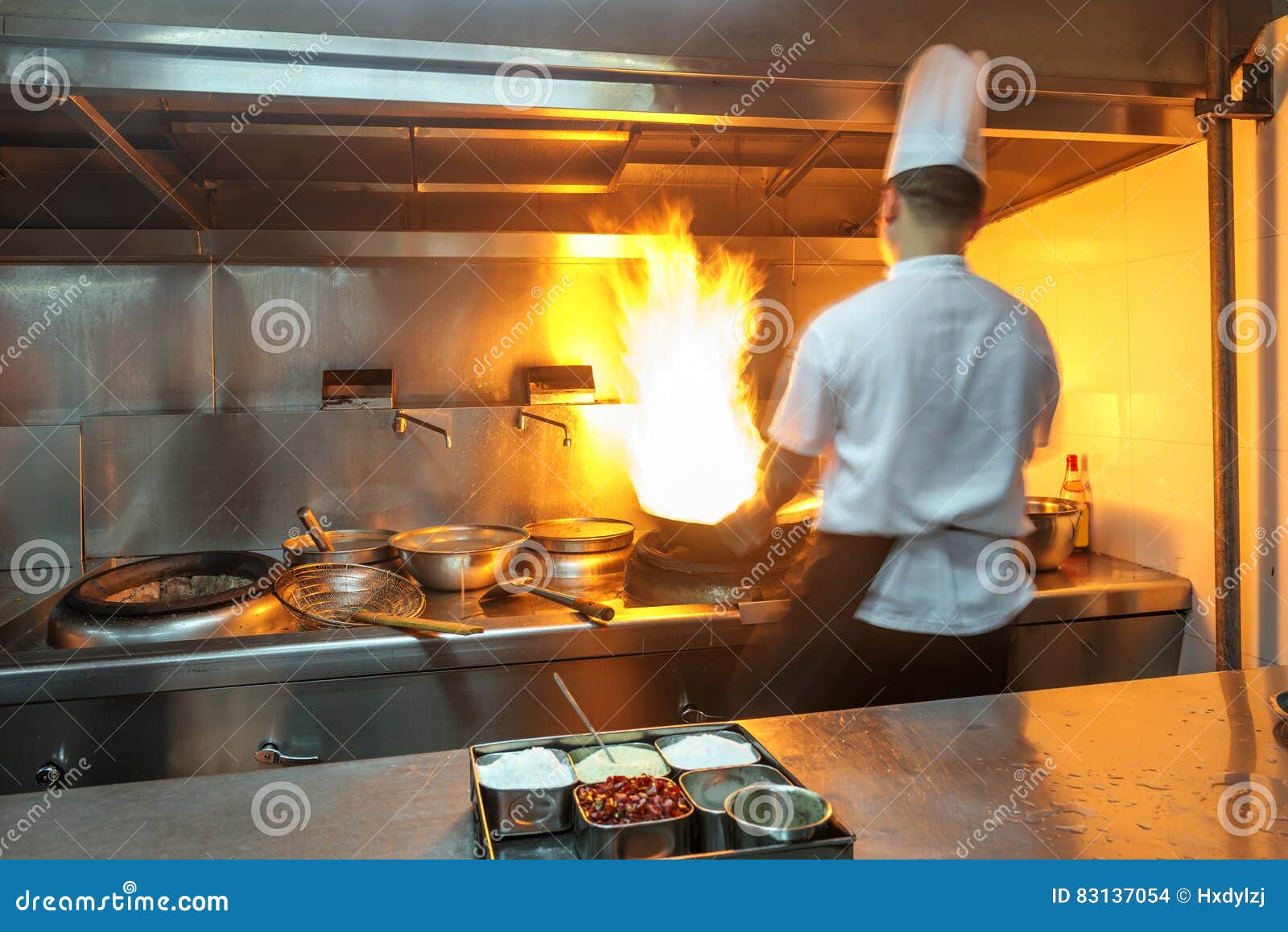 Chef in Restaurant Kitchen at Stove with Pan Stock Photo - Image of ...